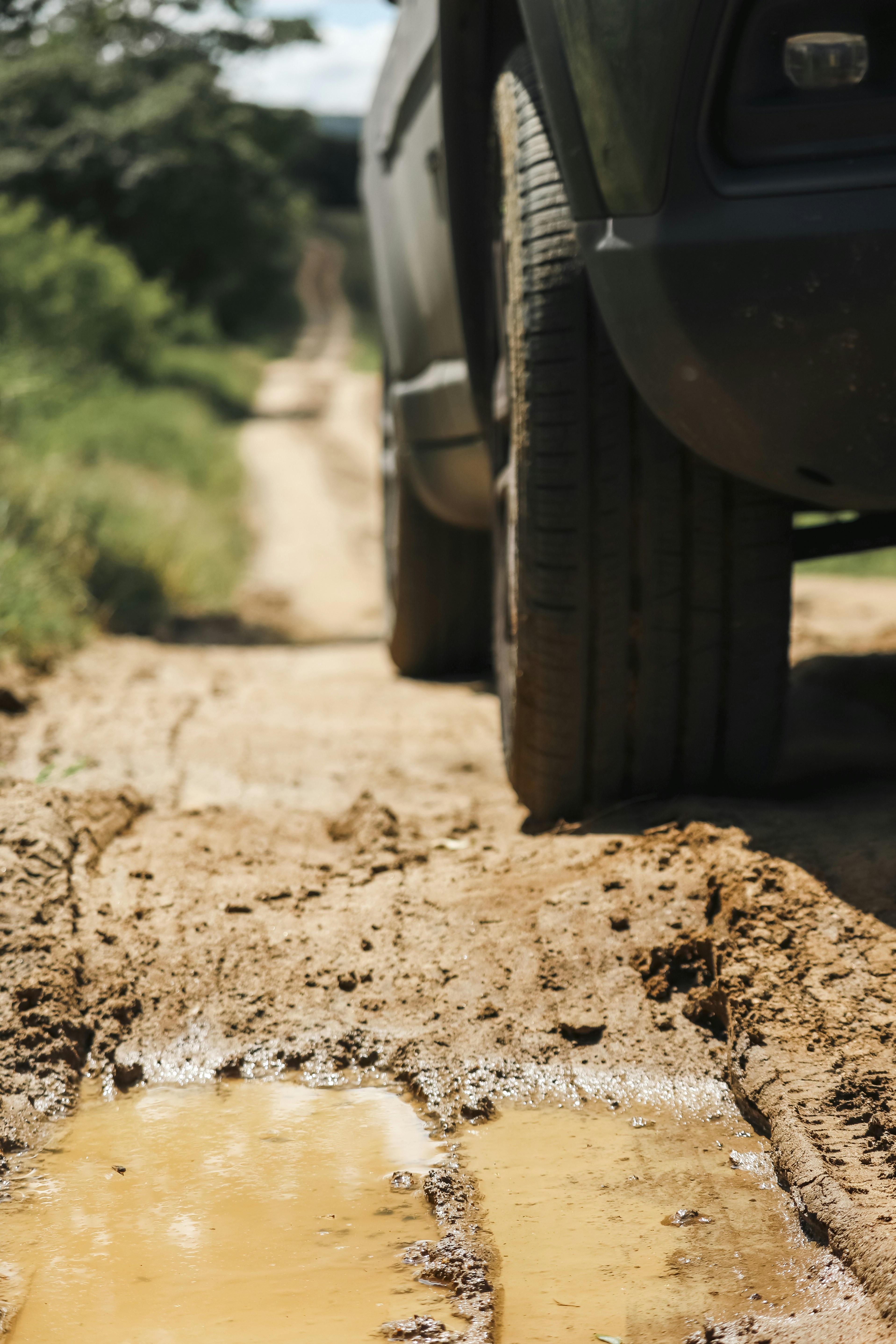 a car is parked in a muddy lot