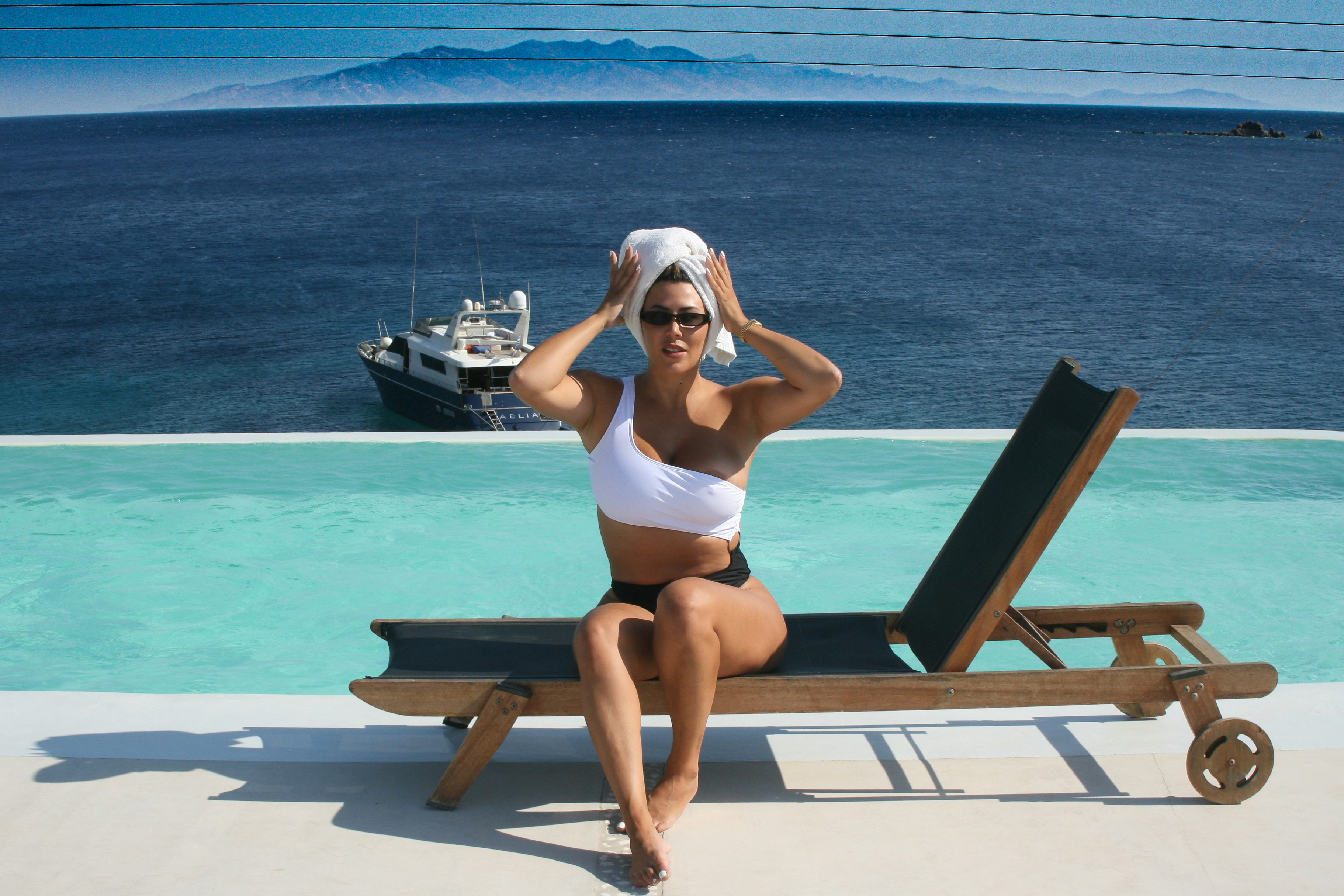 Poolside Reverie by a Turquoise Sea