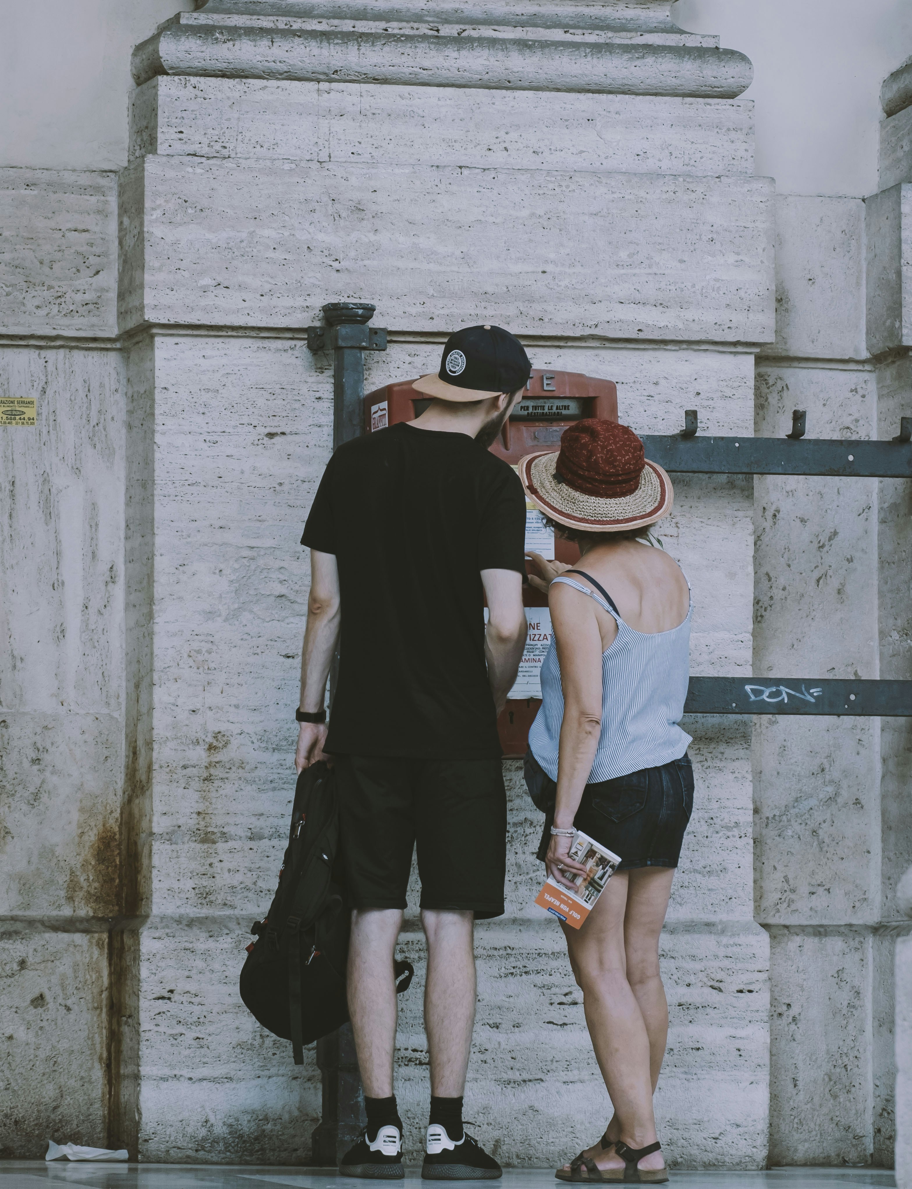 A group of people standing outside a building photo – Free Napoli Image ...