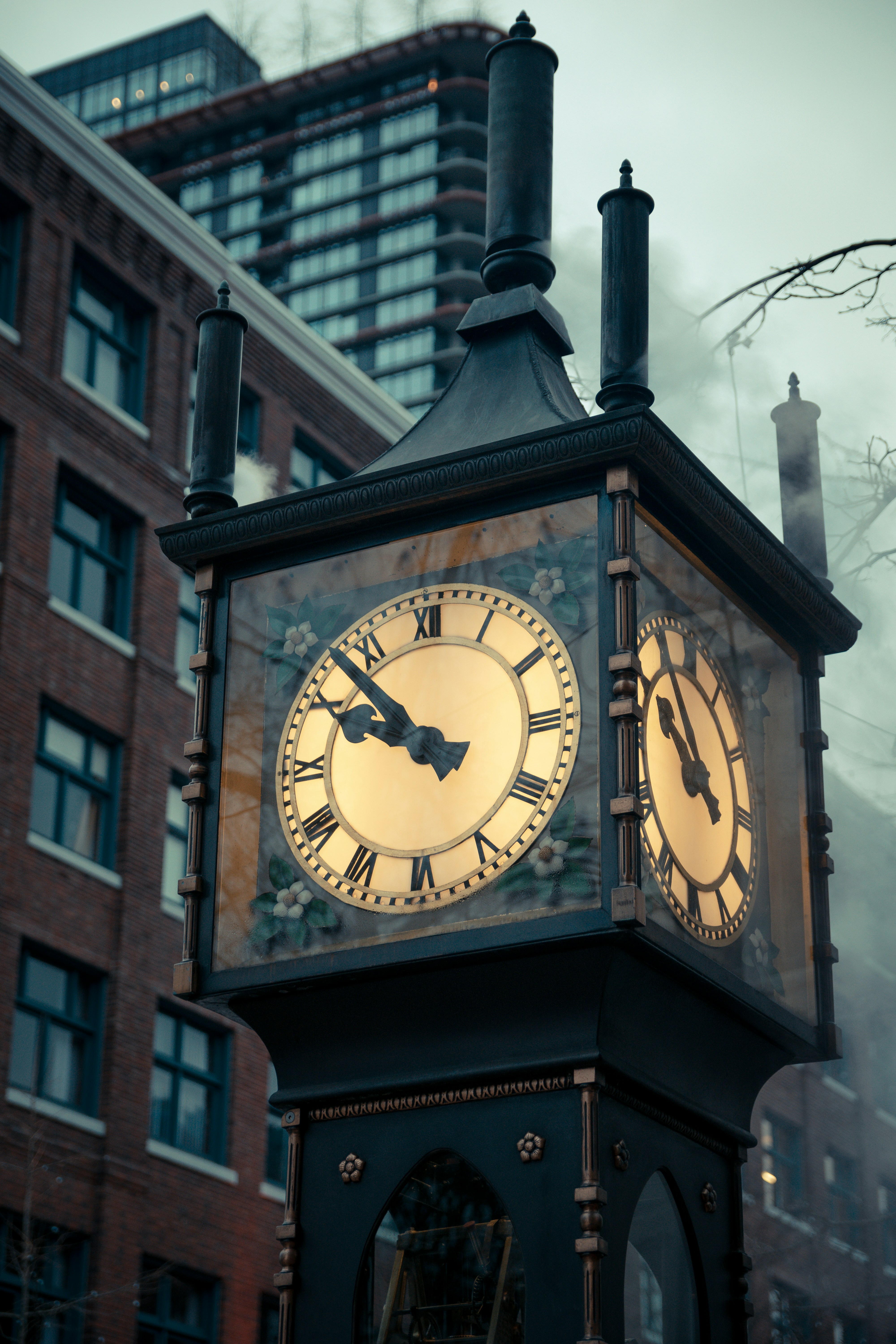 A clock tower with a couple of clocks on it photo – Free Steam clock ...