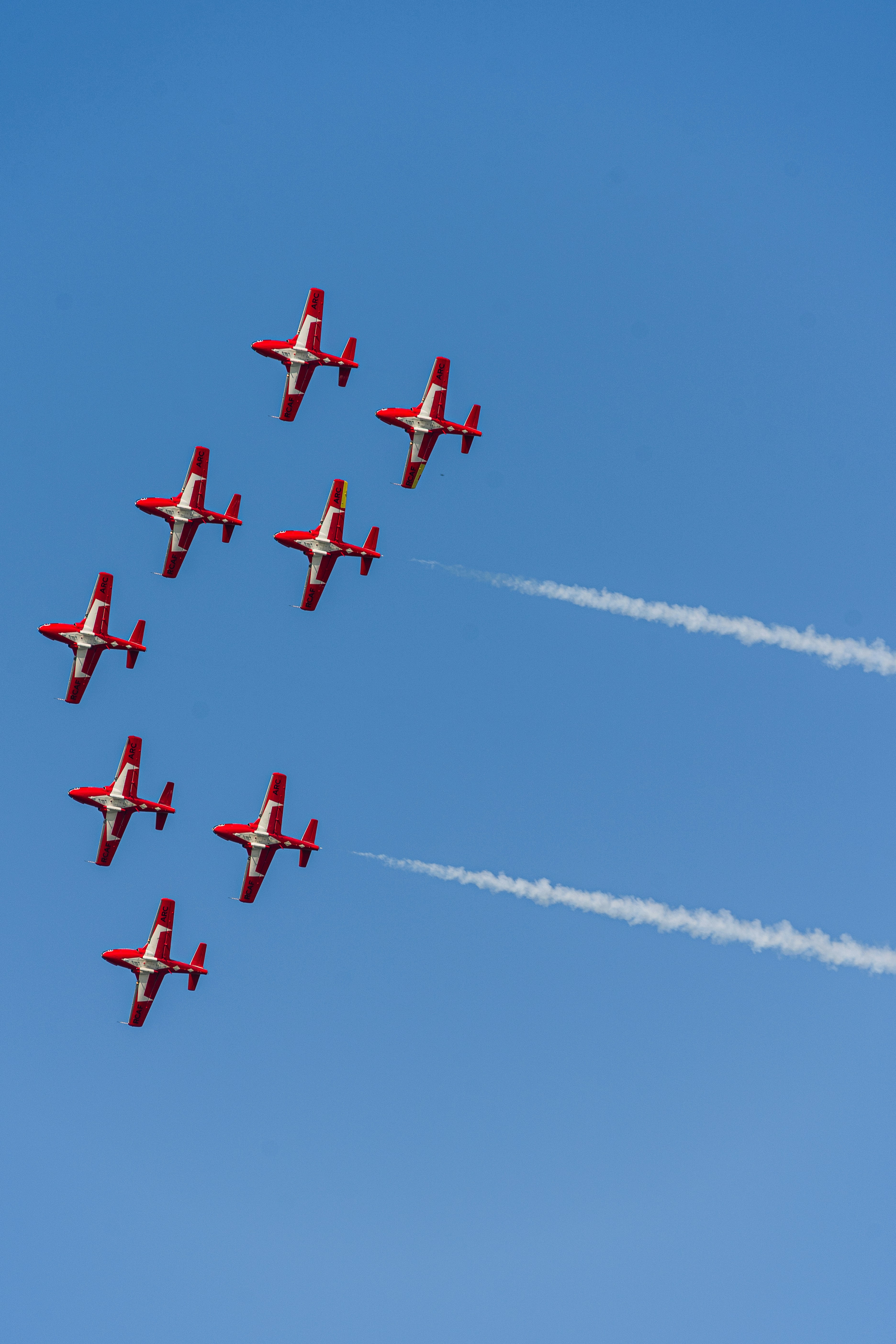 A group of airplanes flying in formation photo – Free Canada Image on ...