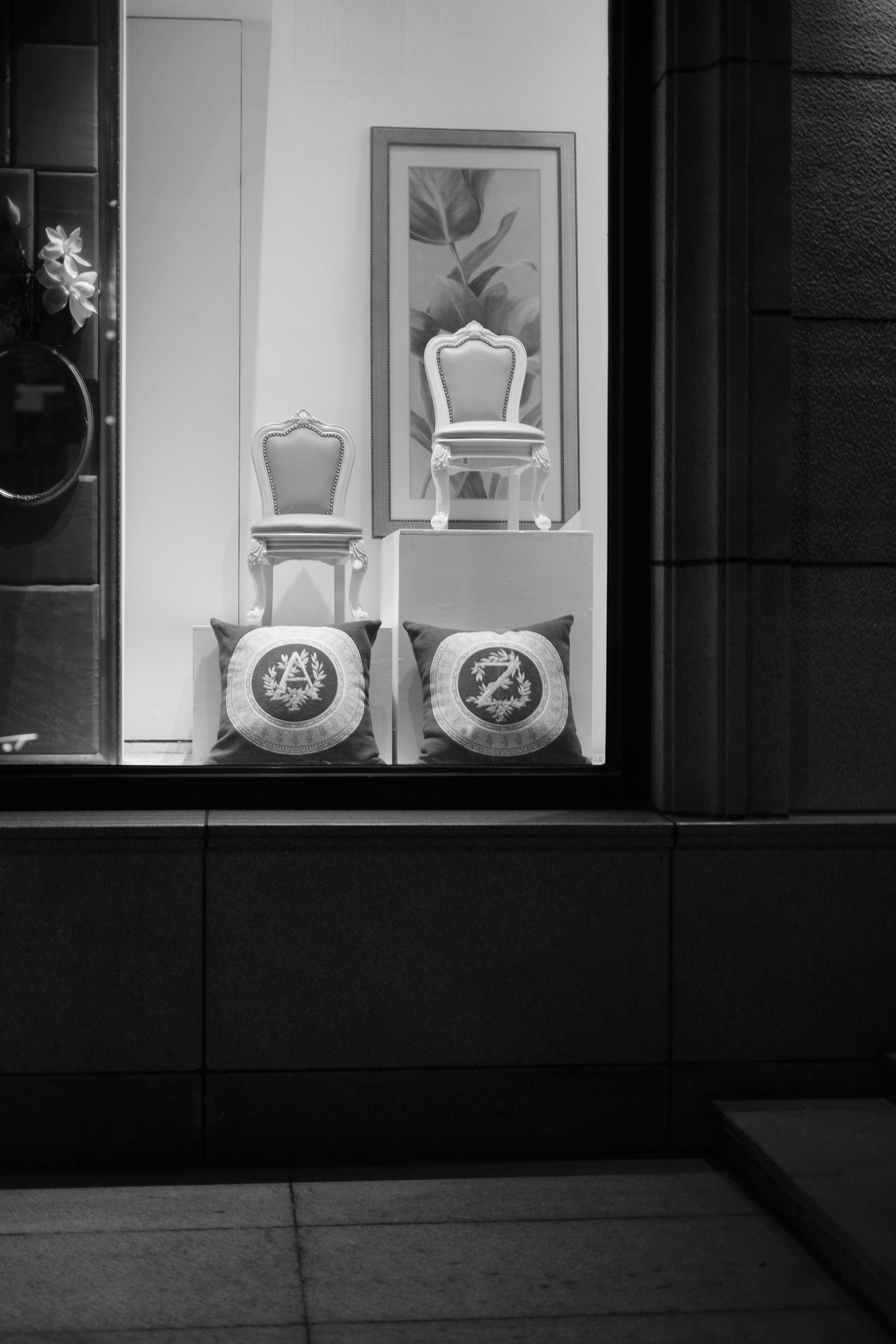 Monochrome Window Stage: Twin Regency Chairs and Emblem Cushions