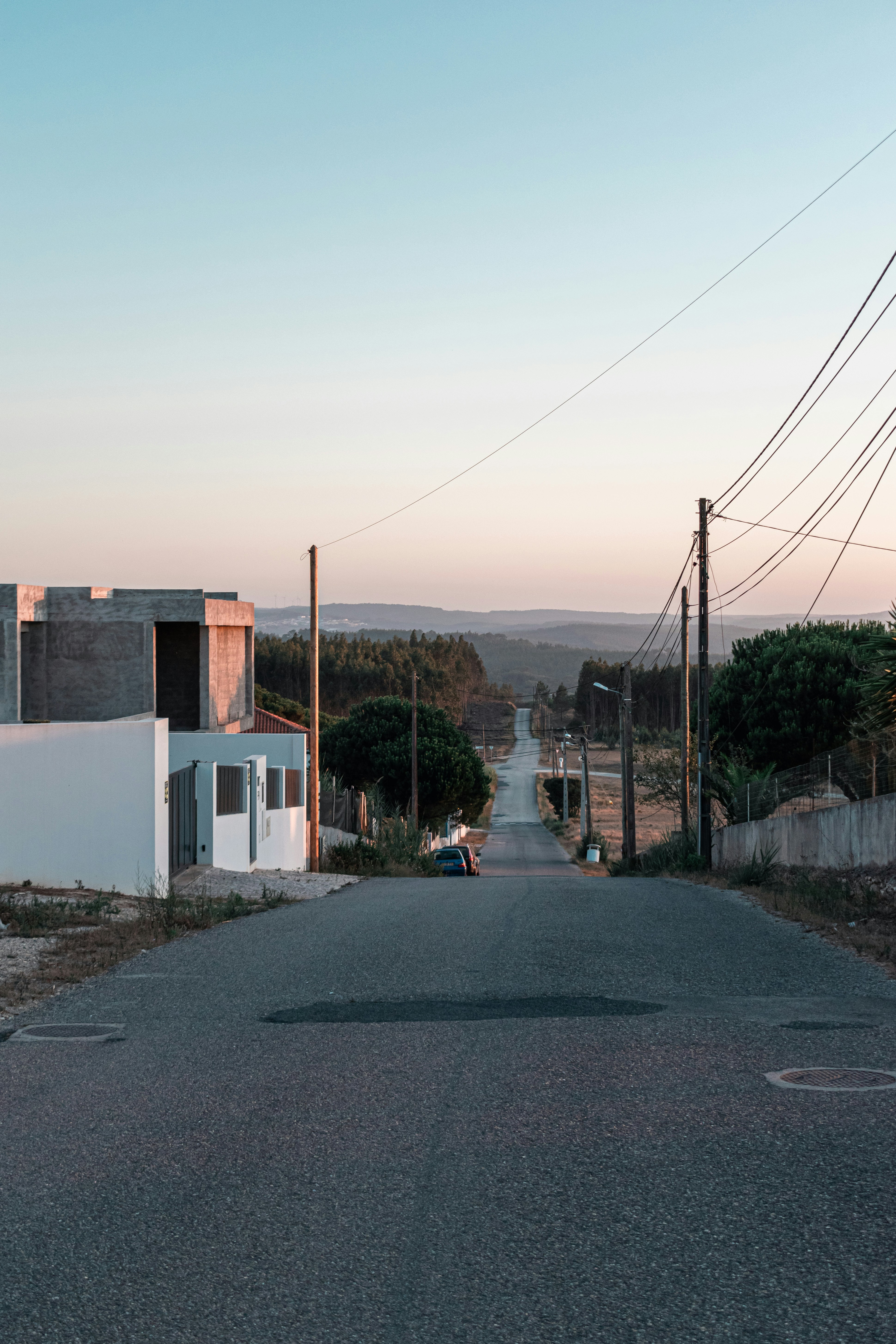 A road with buildings and trees on the side photo – Free Image on Unsplash