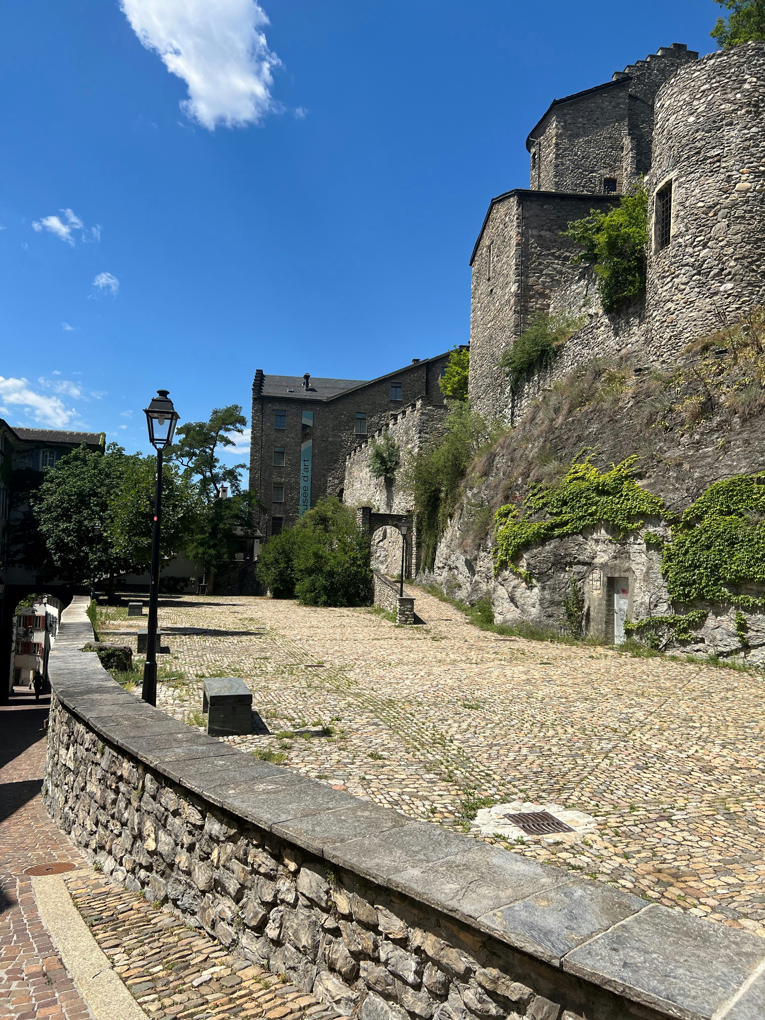 A stone wall with a stone wall and a stone wall with a stone building ...