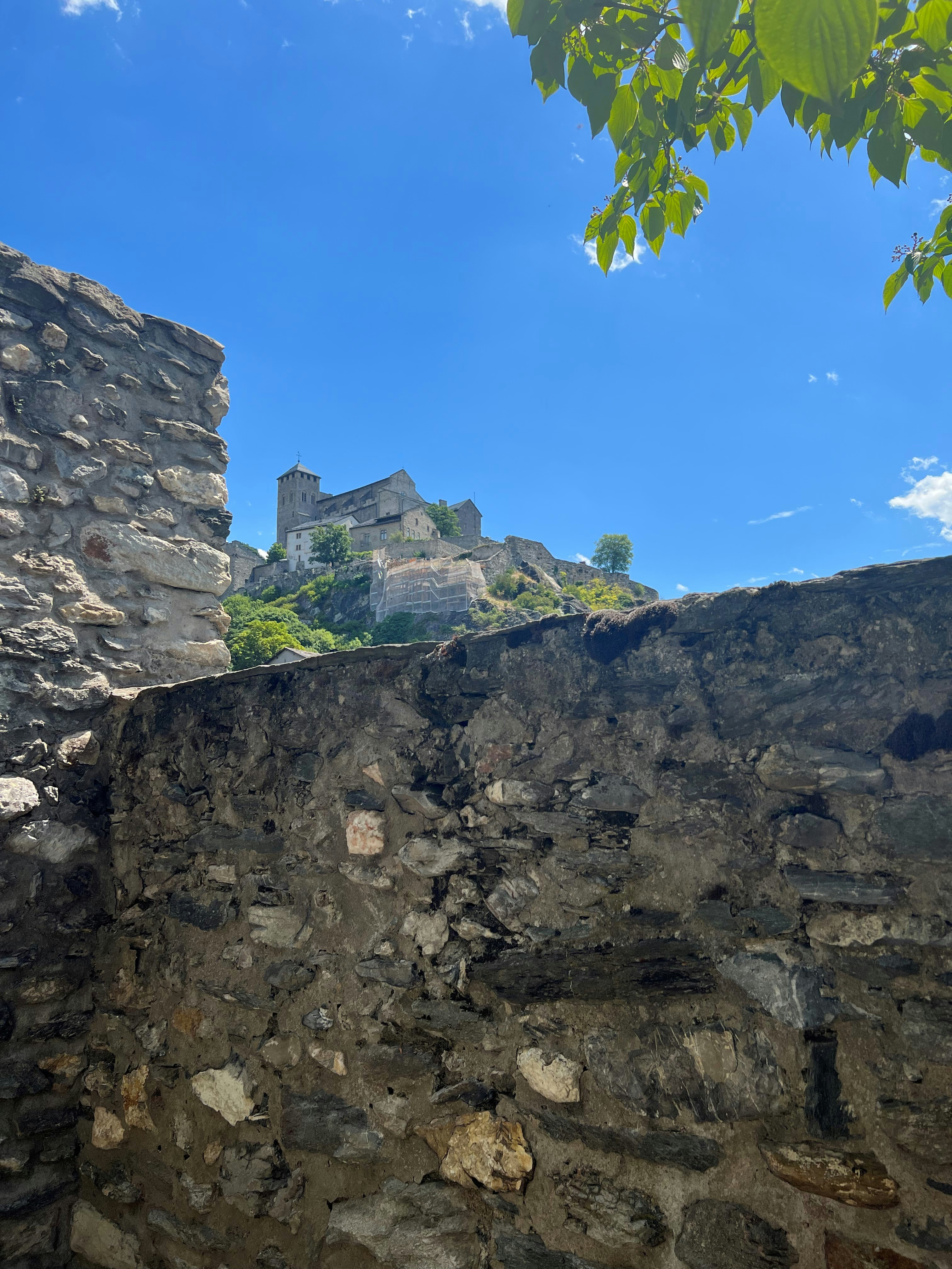 A stone wall with a castle on top photo – Free Sion Image on Unsplash