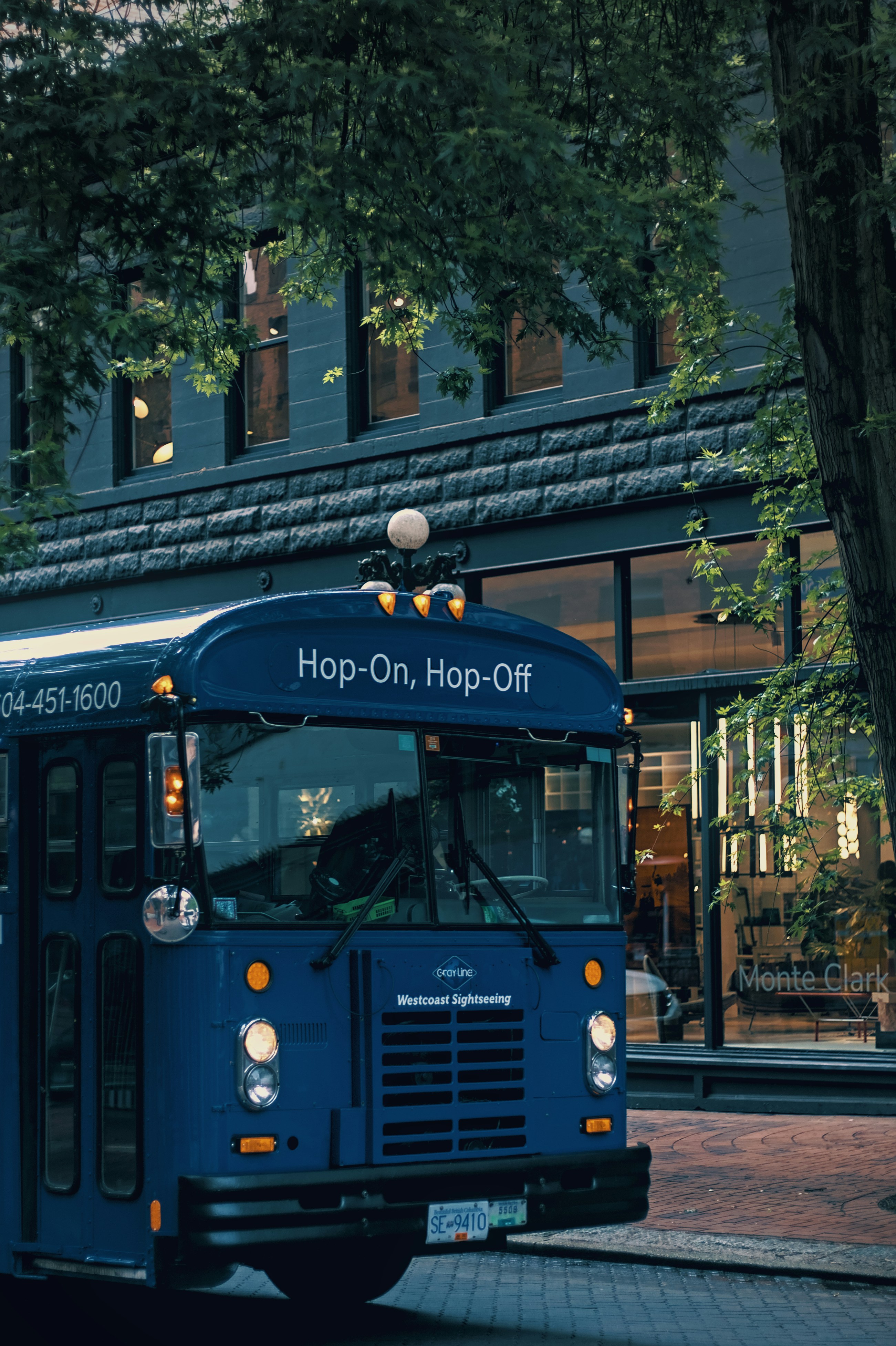 a blue bus on the street