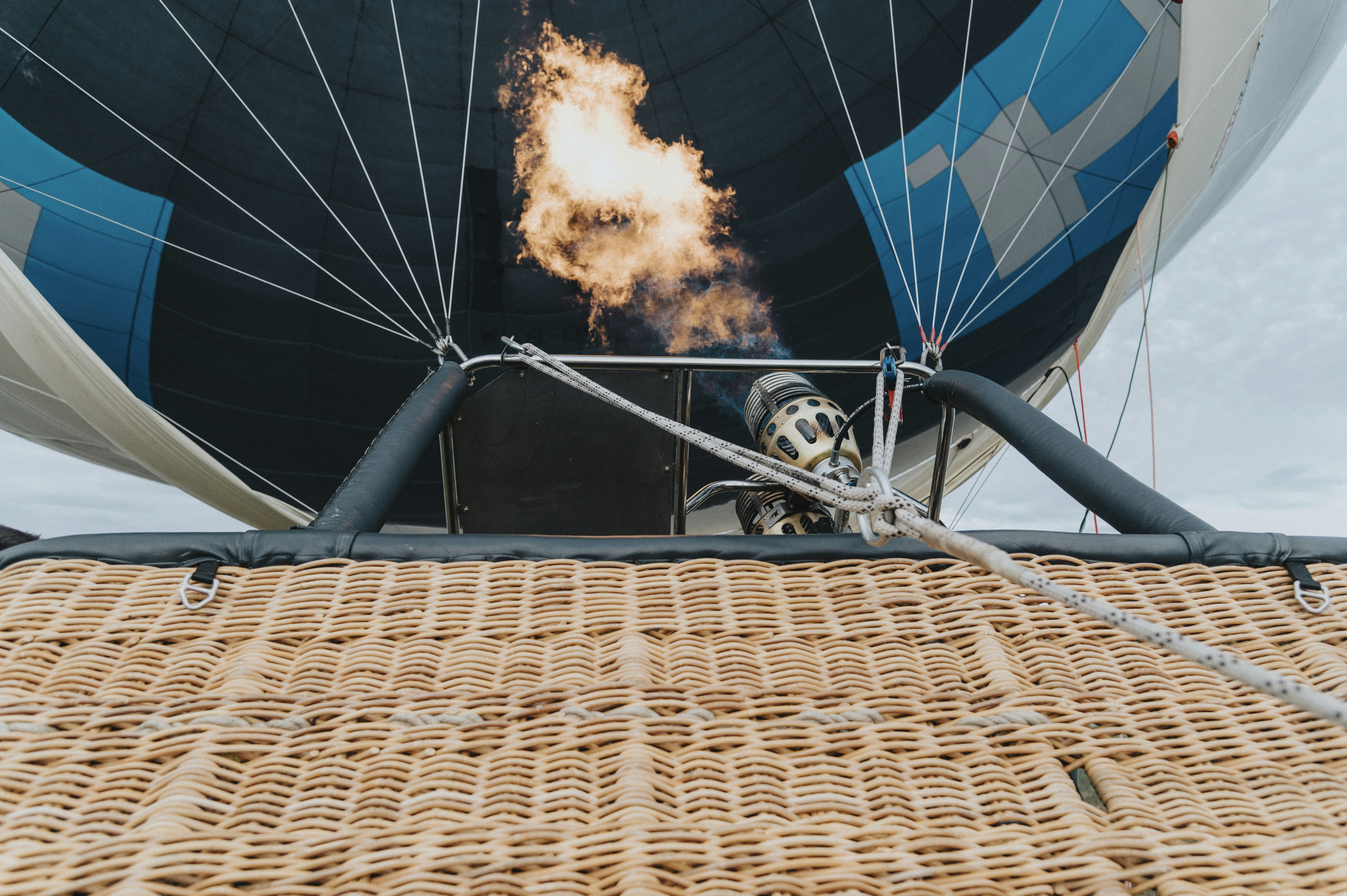 Under the Balloon: Burner Flame Surging Through Wicker and Sky