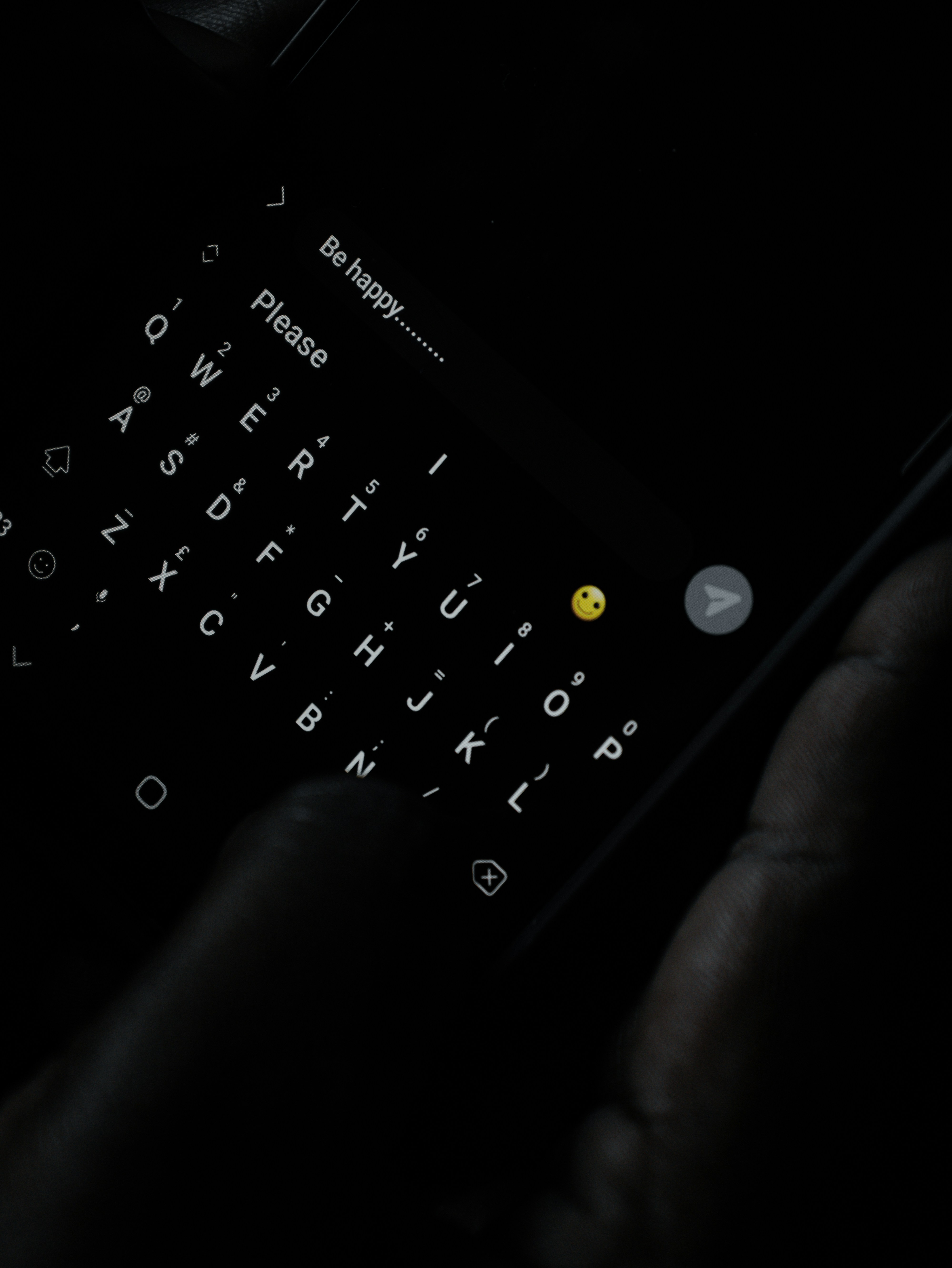 a hand holding a remote control