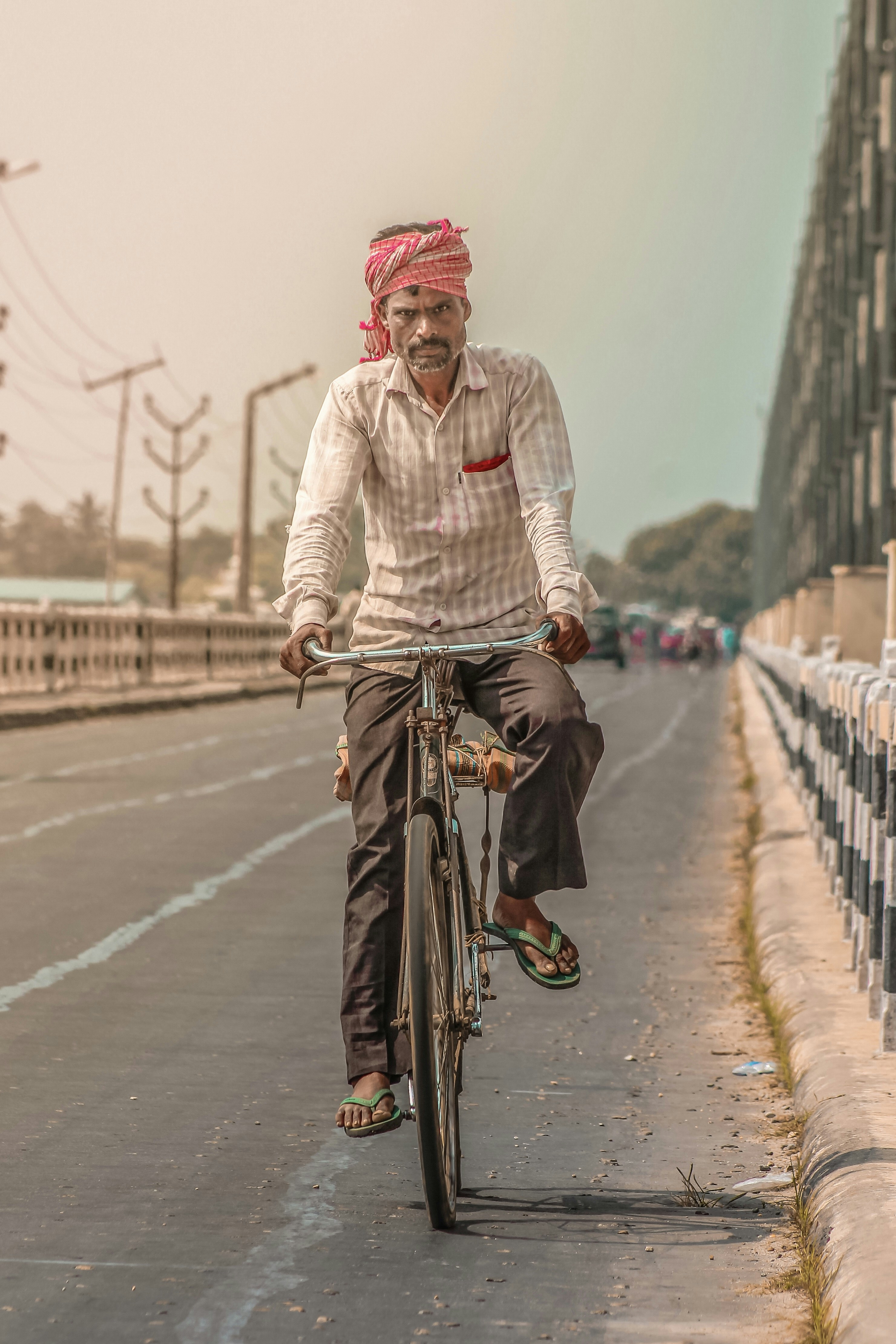 A man riding a bicycle photo – Free Grey Image on Unsplash