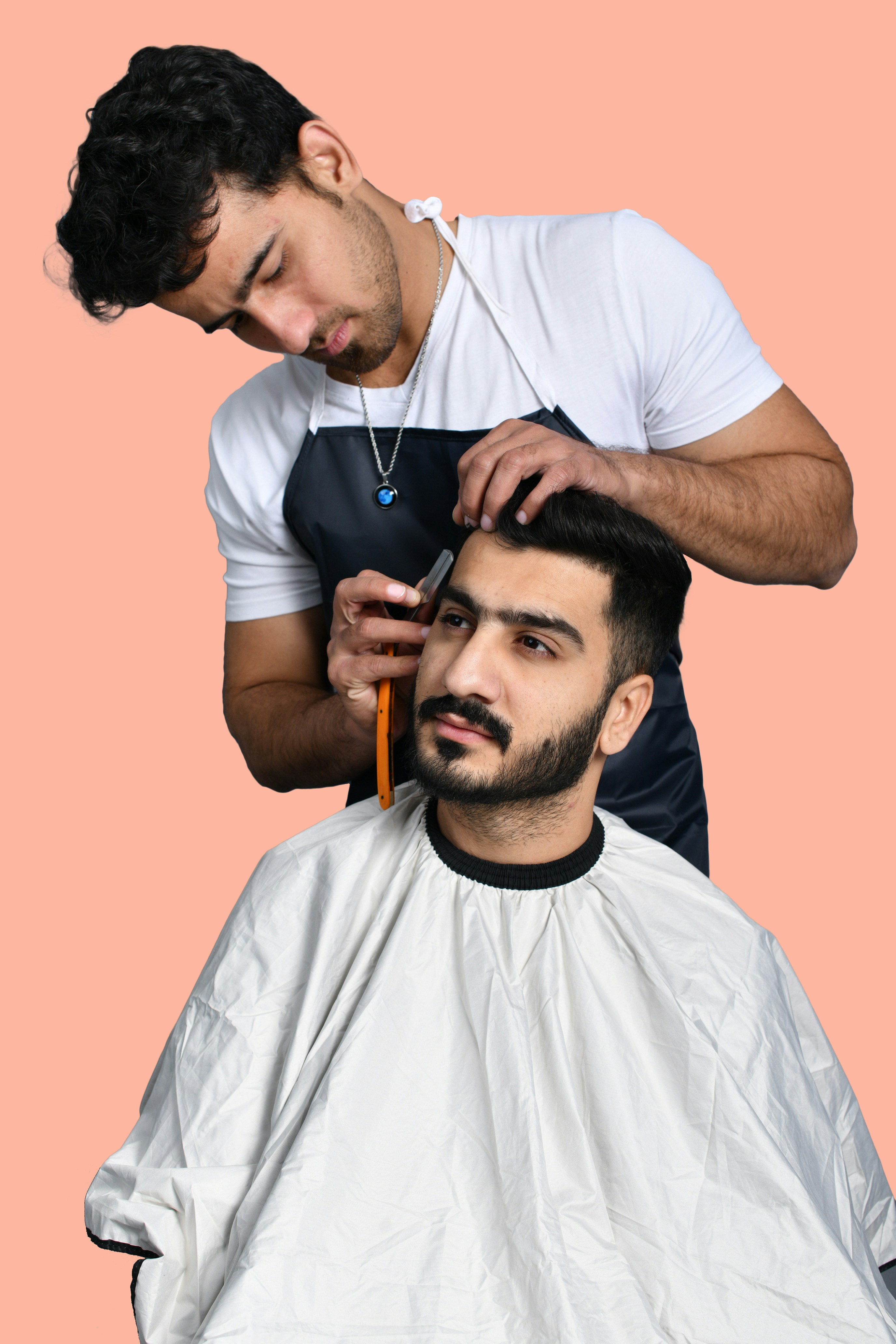 A man cutting another man's hair photo – Free Worker Image on Unsplash