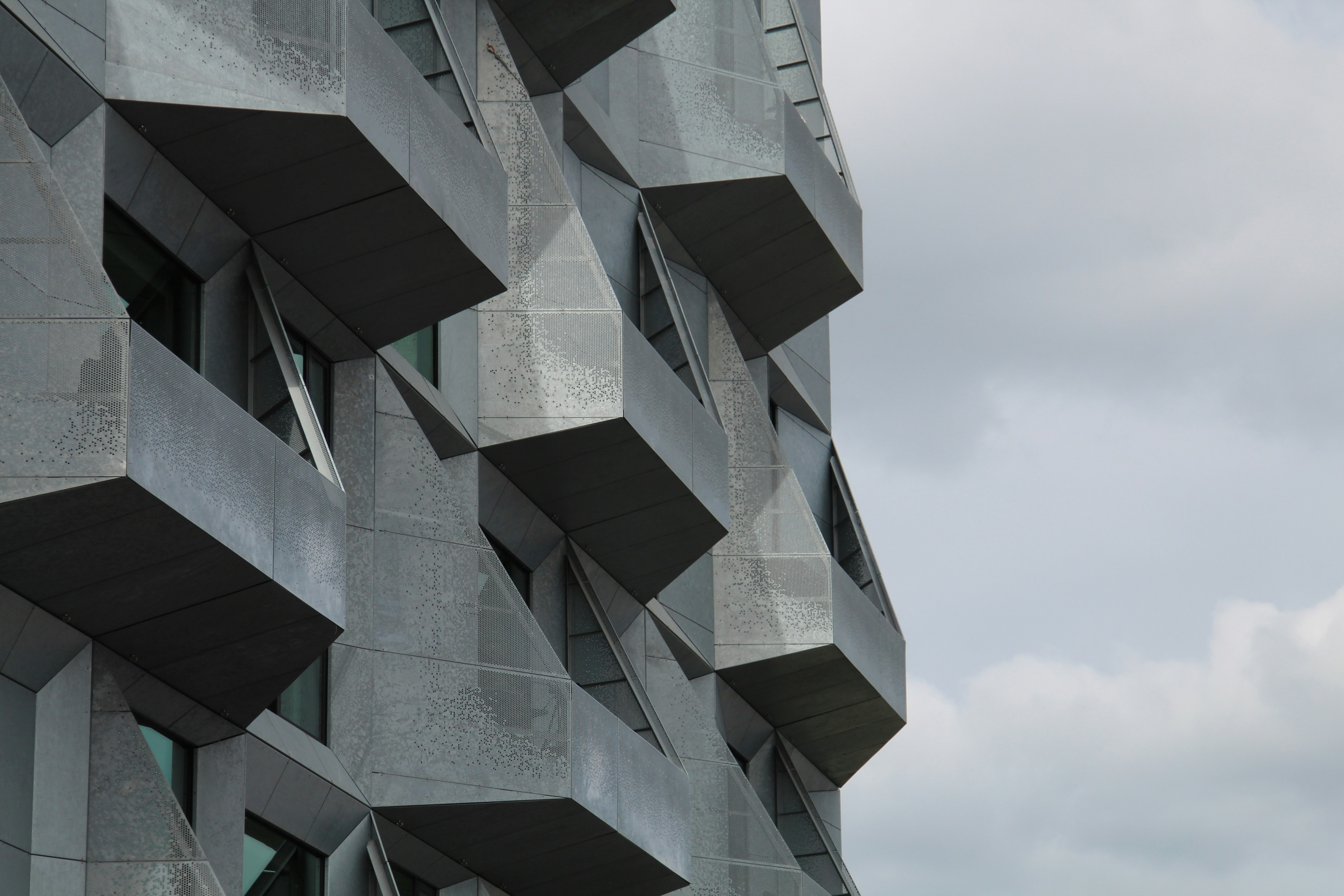 Angular Echoes: Staggered balconies sculpt a concrete skyline