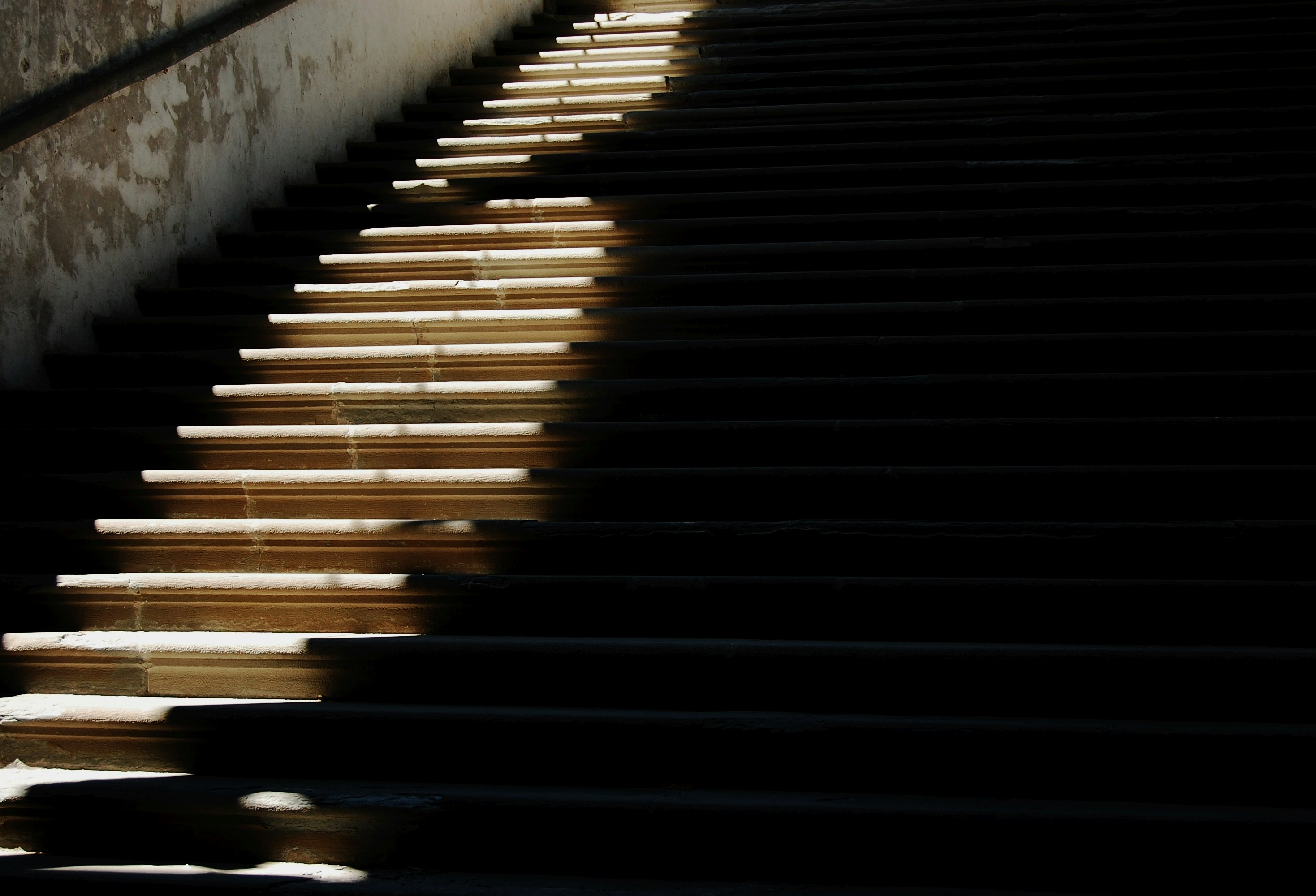 Staircase in Shadowed Light: Steps Carved by Sunlit Stripes