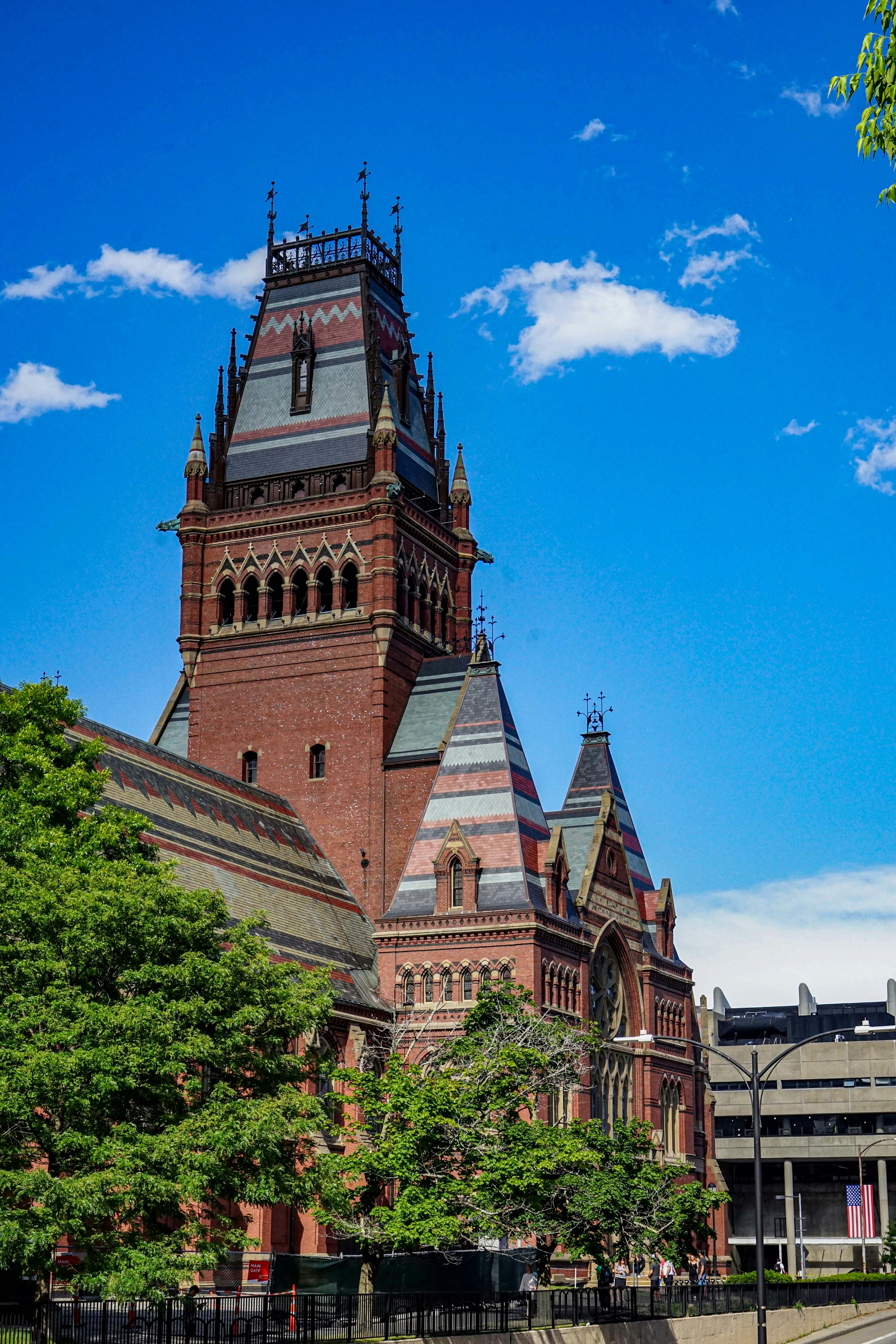 A large brick building with a tower photo – Free Harvard university ...