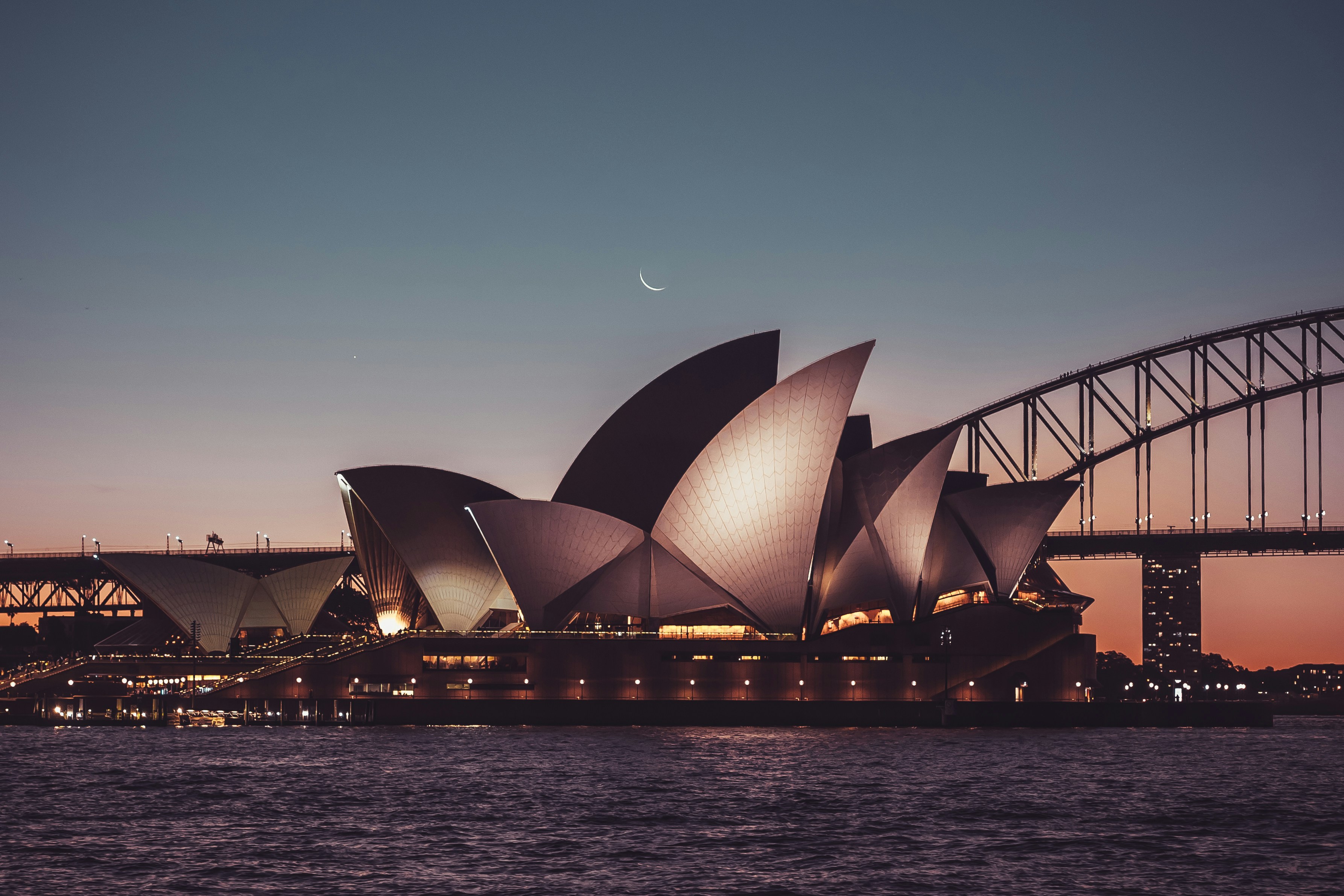 A large building with Sydney Opera House over it photo – Free Sunset ...