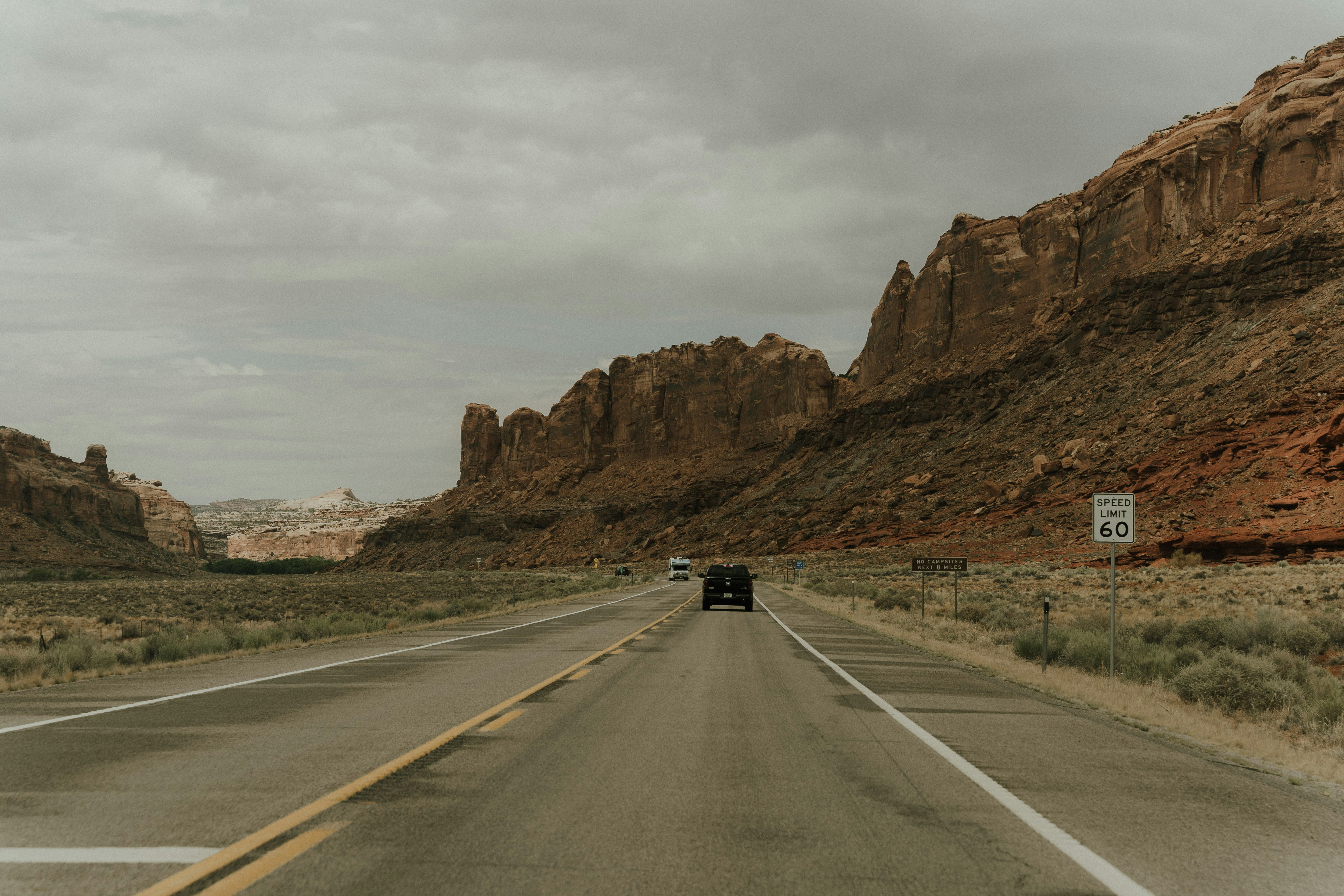 Cars driving on a road photo – Free Moab Image on Unsplash
