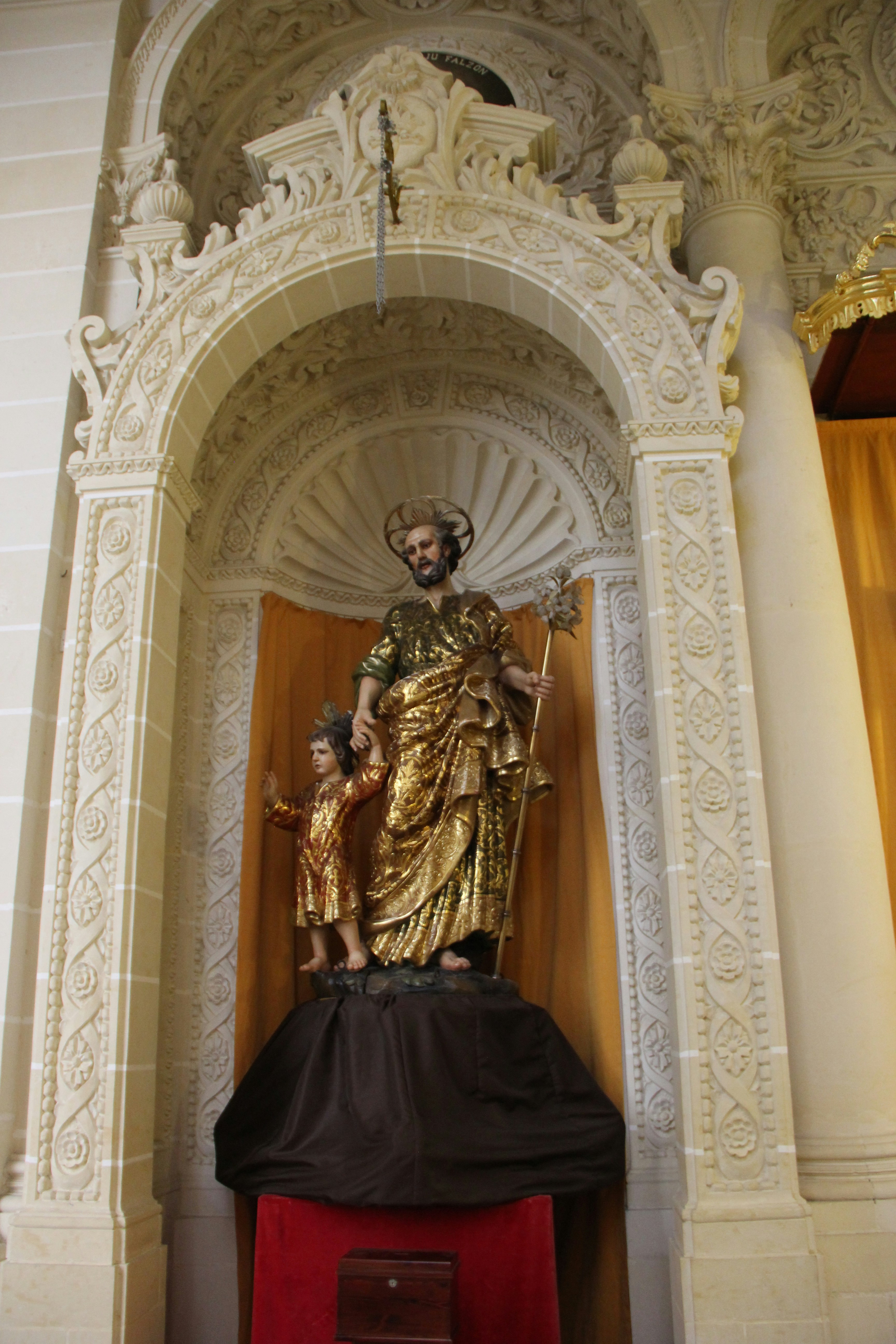 Gilded Saint and Child Amid Ornate Baroque Archways