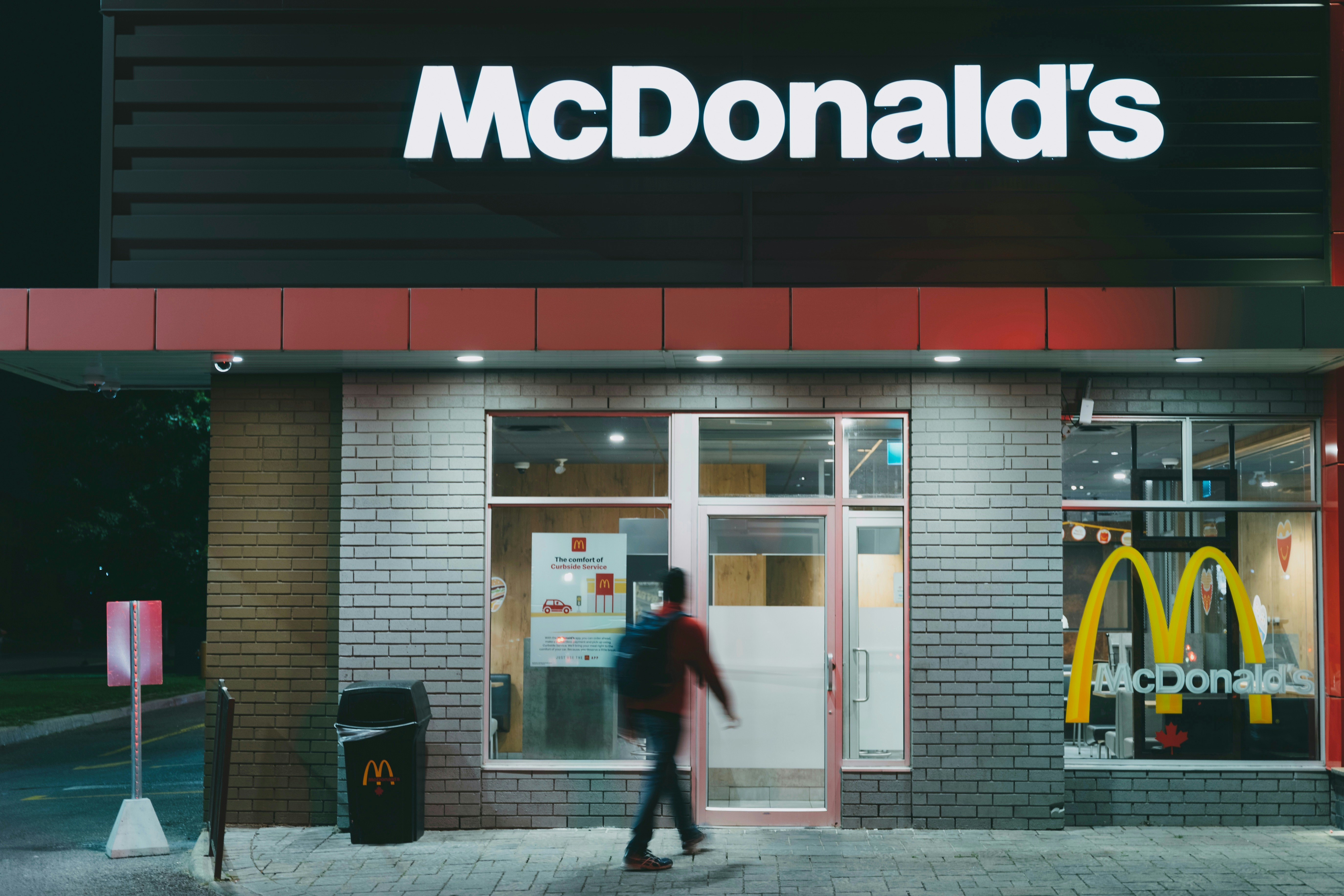 A person walking out of a store photo – Free Ottawa Image on Unsplash