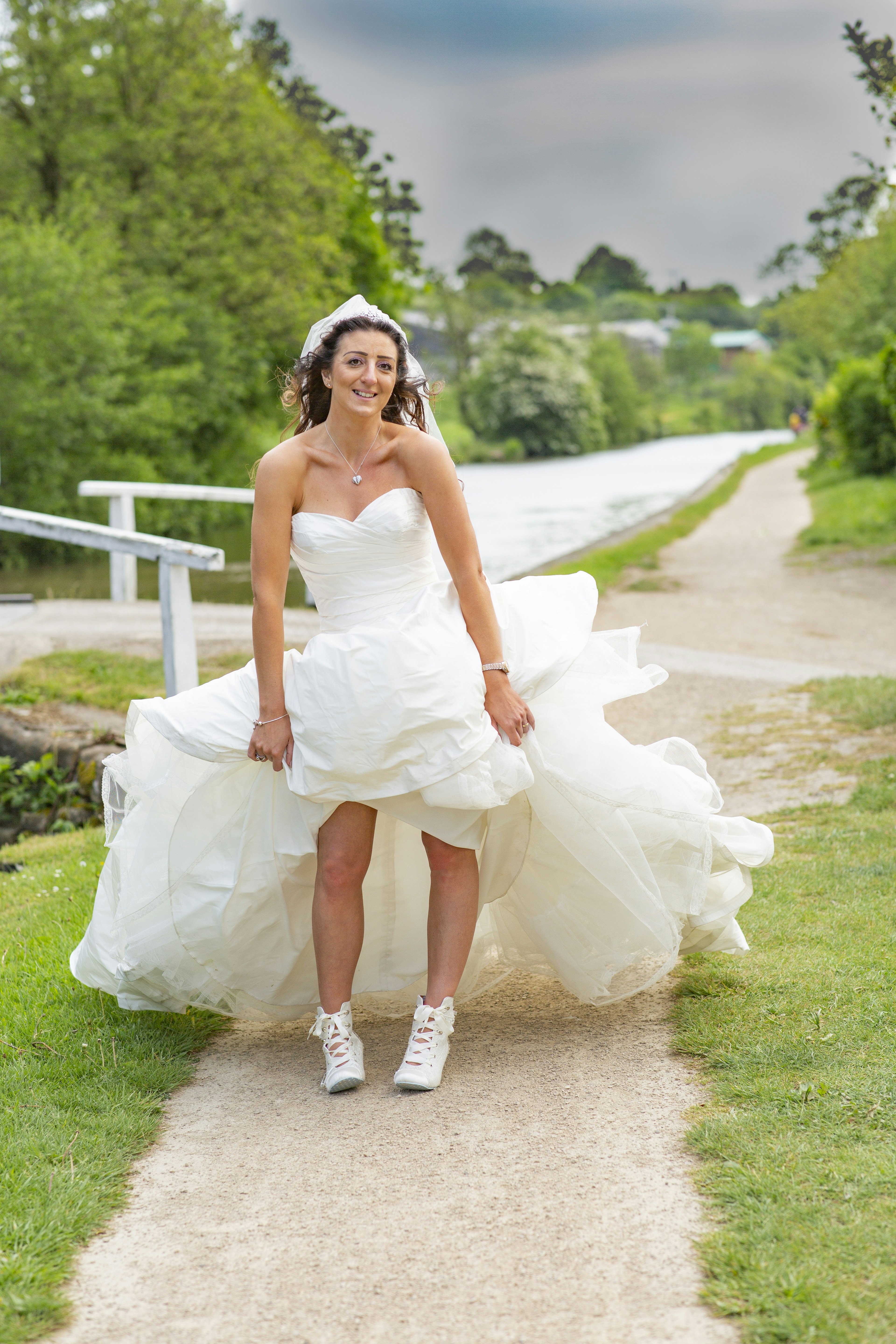 Veil and Gown on the Riverside Path