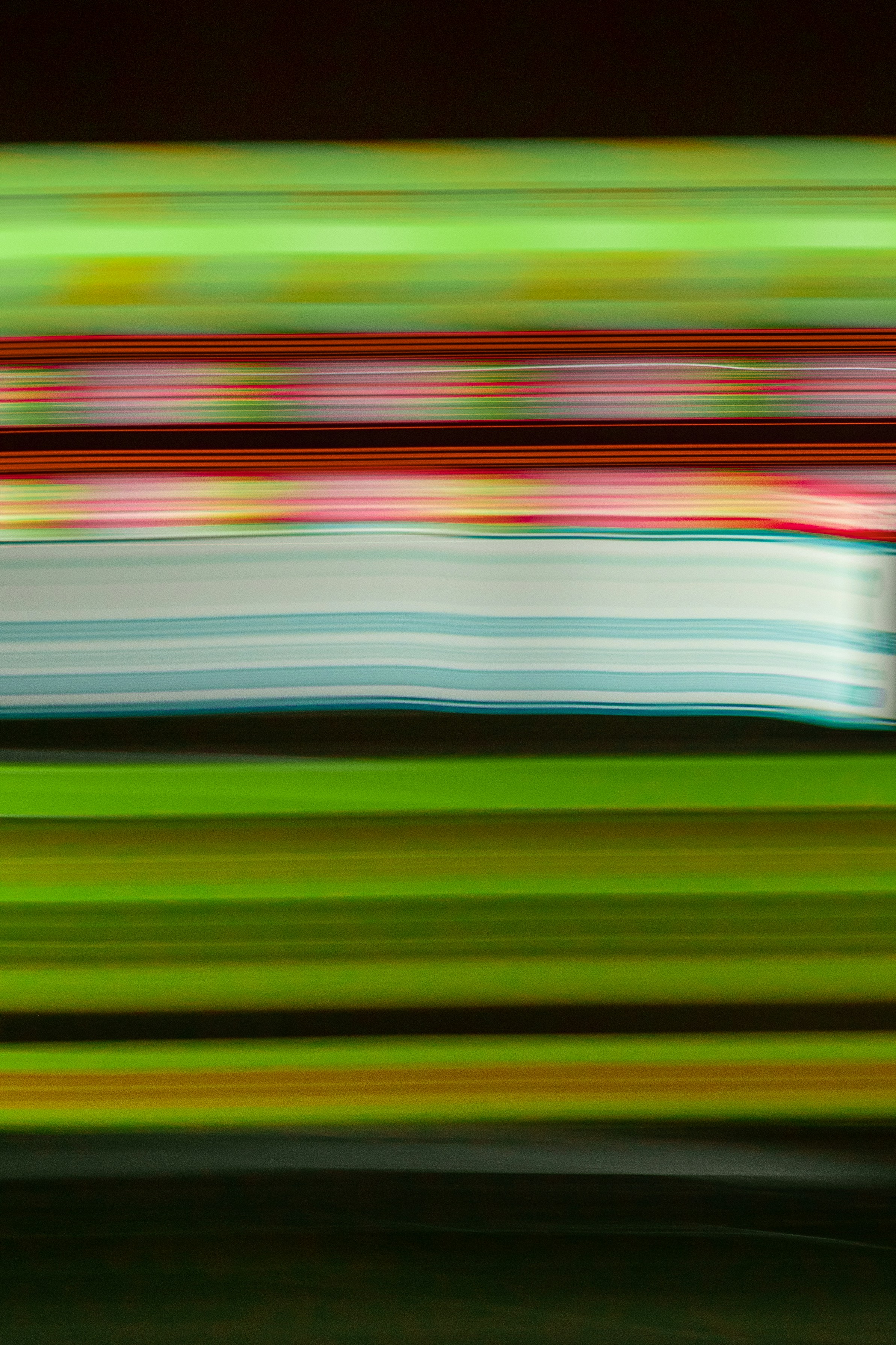 Rhythms of Color: Horizontal Motion in a Neon Stripe Scene
