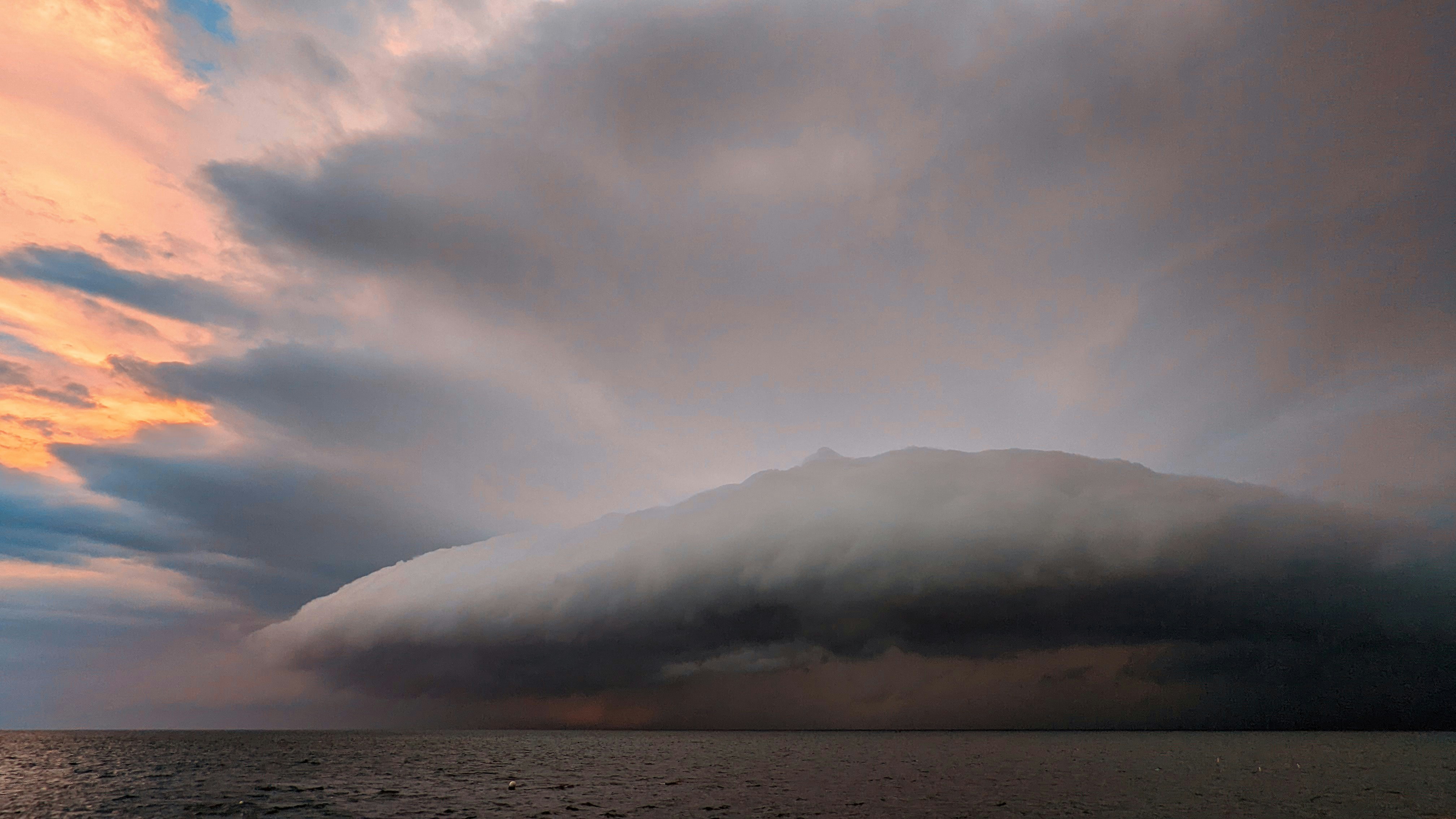 Horizon Cloud Shelf Over a Velvet Sea at Dusk