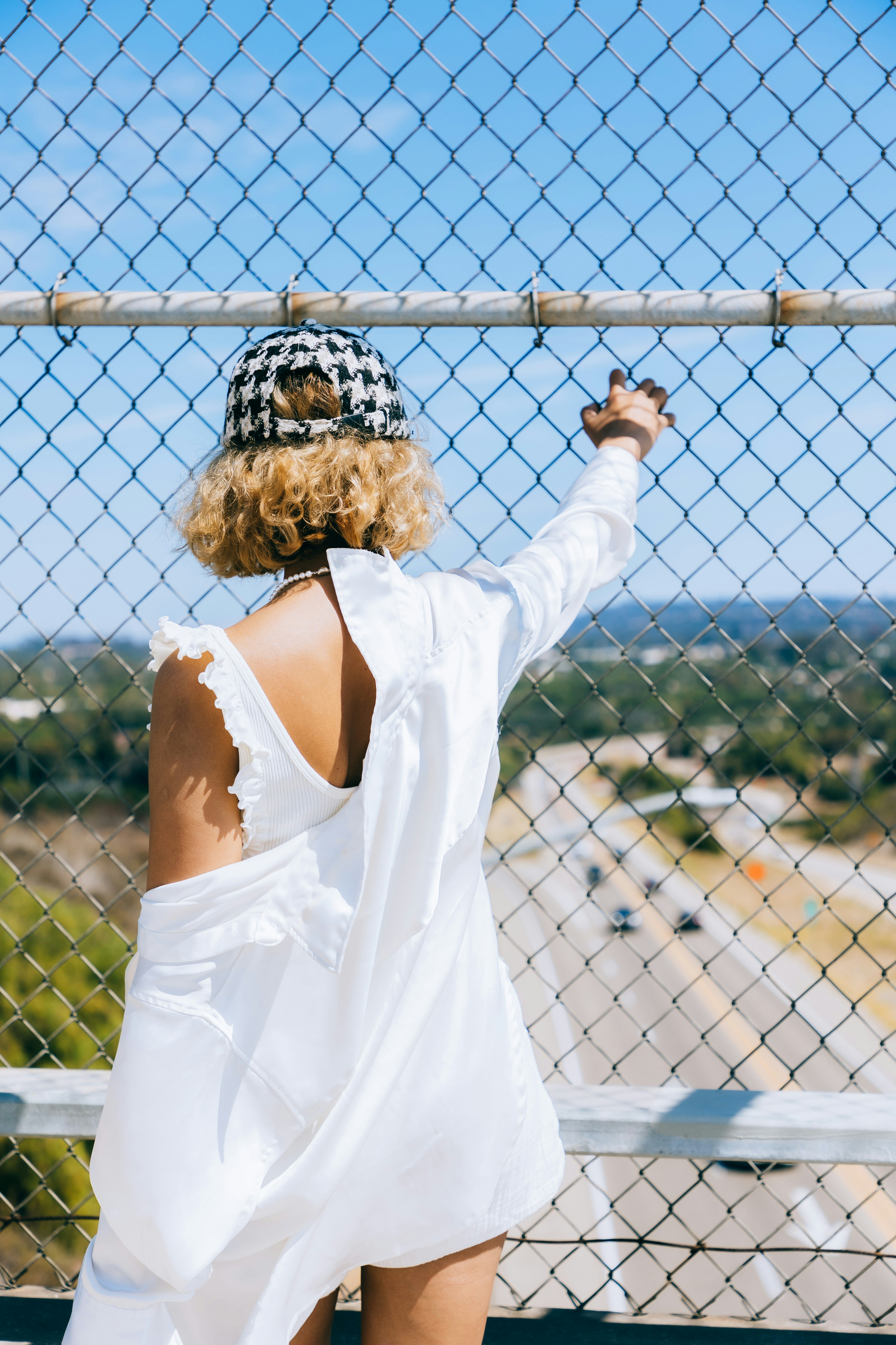 Above the Fence: A Freehand Pose at the Horizon