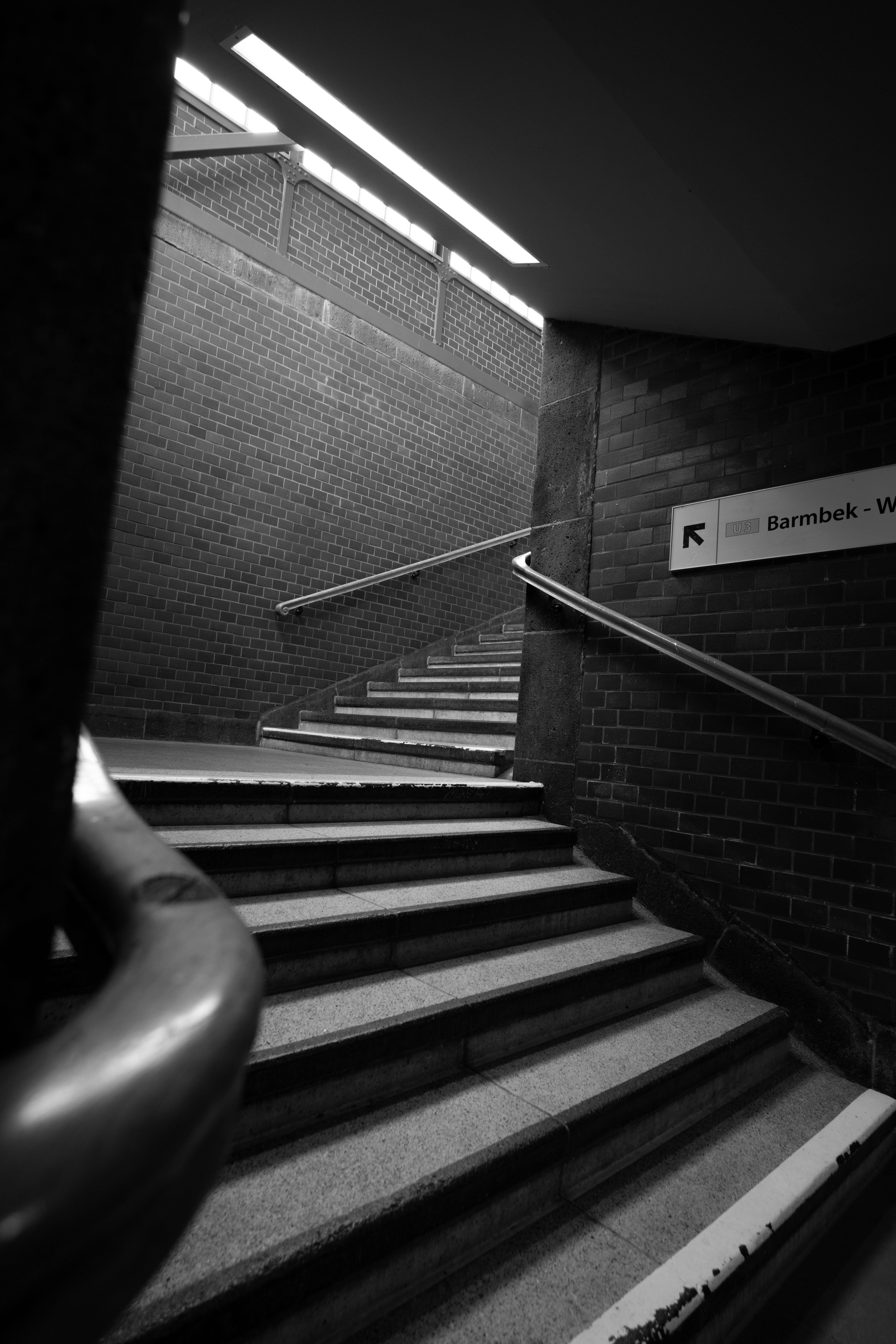 Monochrome Geometry: Diagonal Rails in an Underground Stairwell
