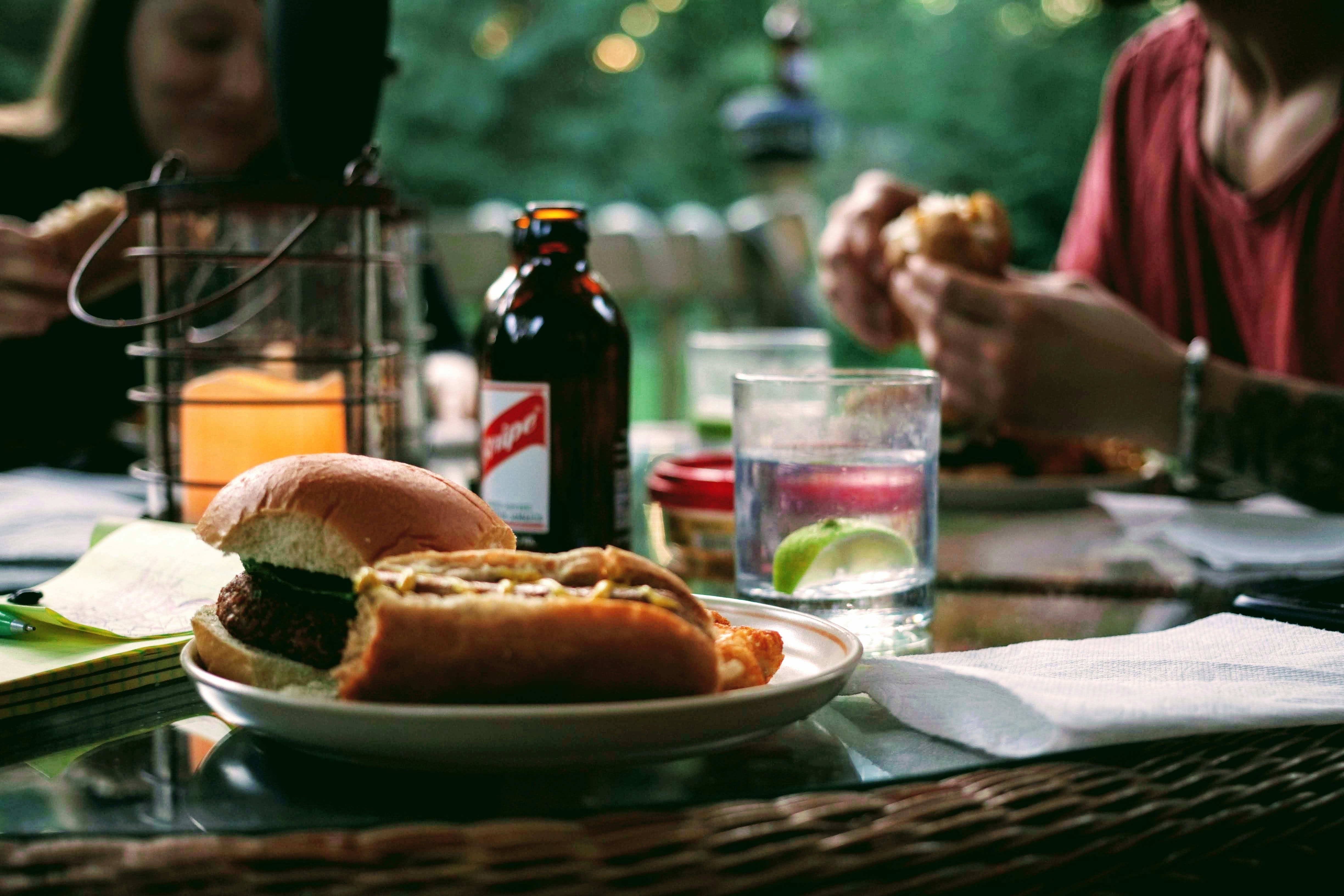 a table with plates of food and drinks on it