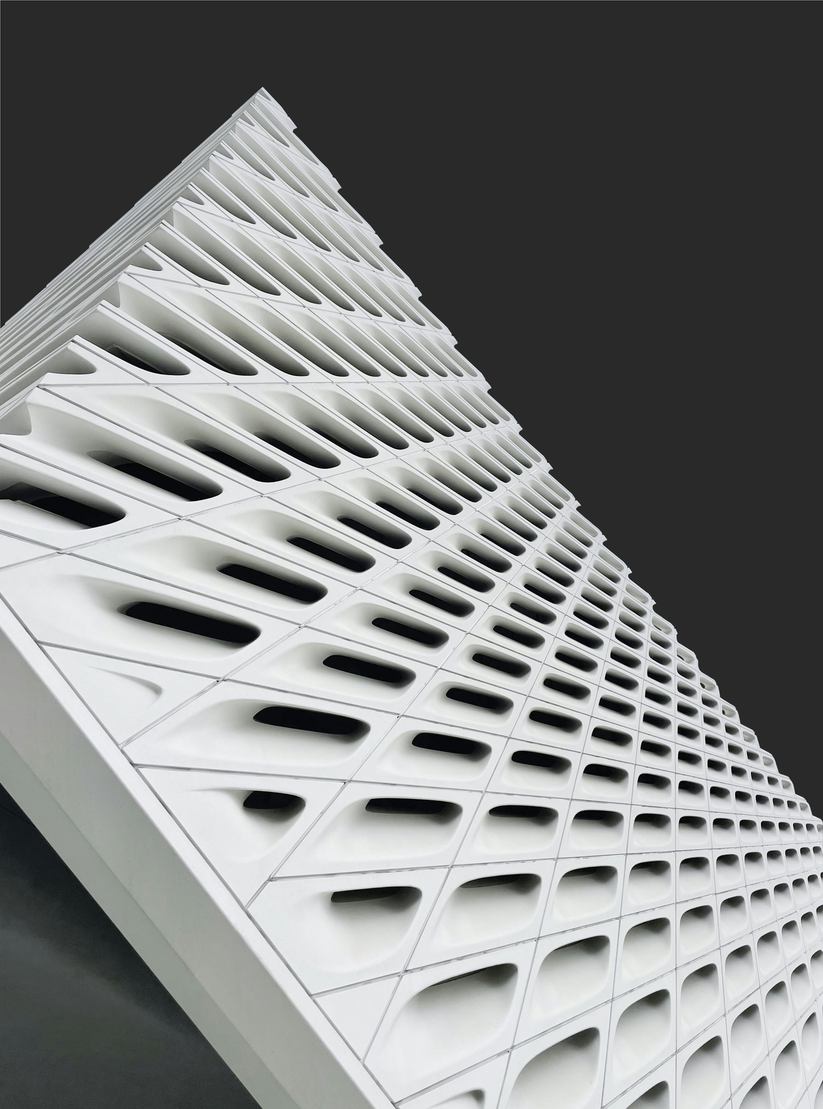 The distinctive architecture of The Broad slays on a black background.  