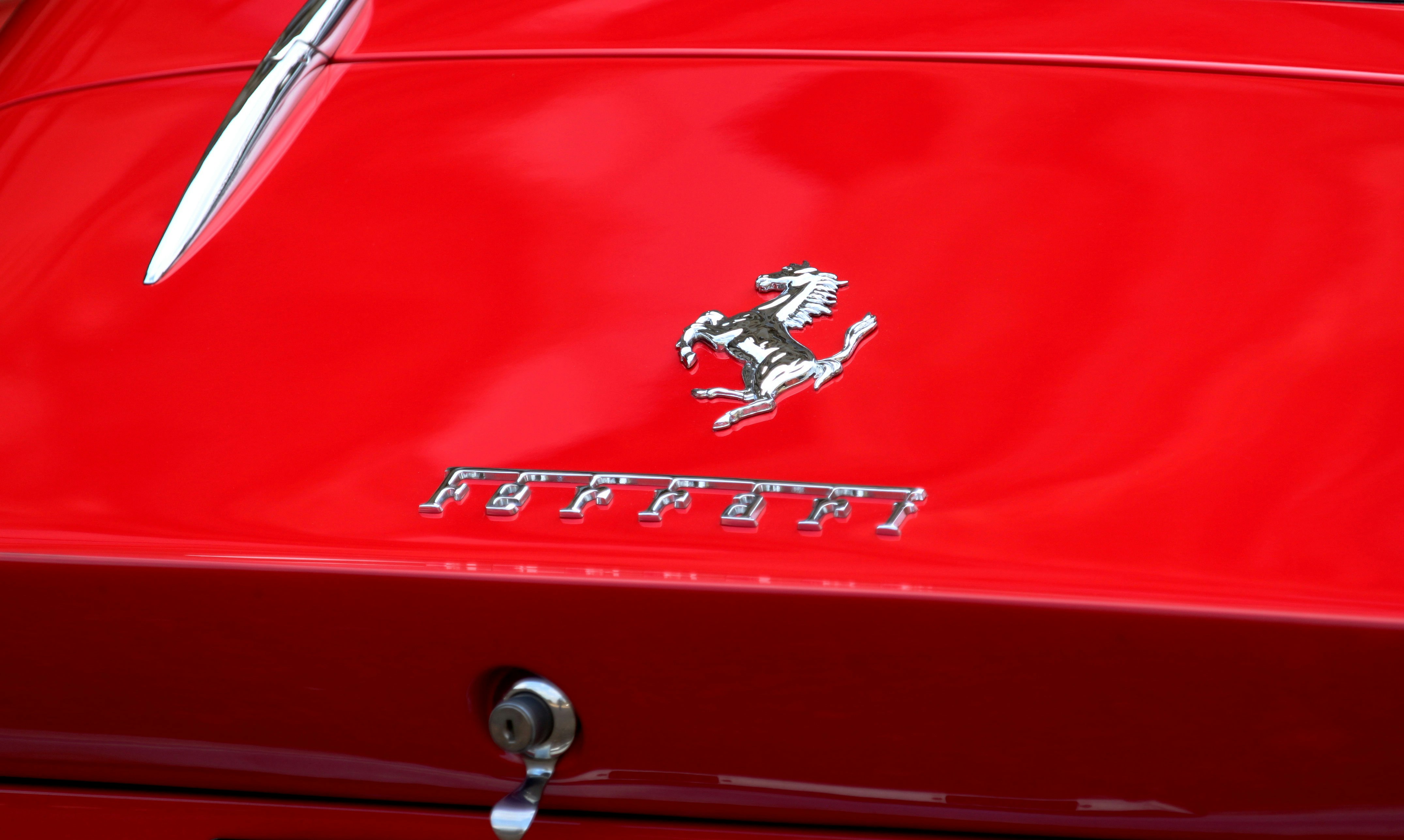 Crimson Badge: The Prancing Horse on a Glossy Ferrari Red Panel