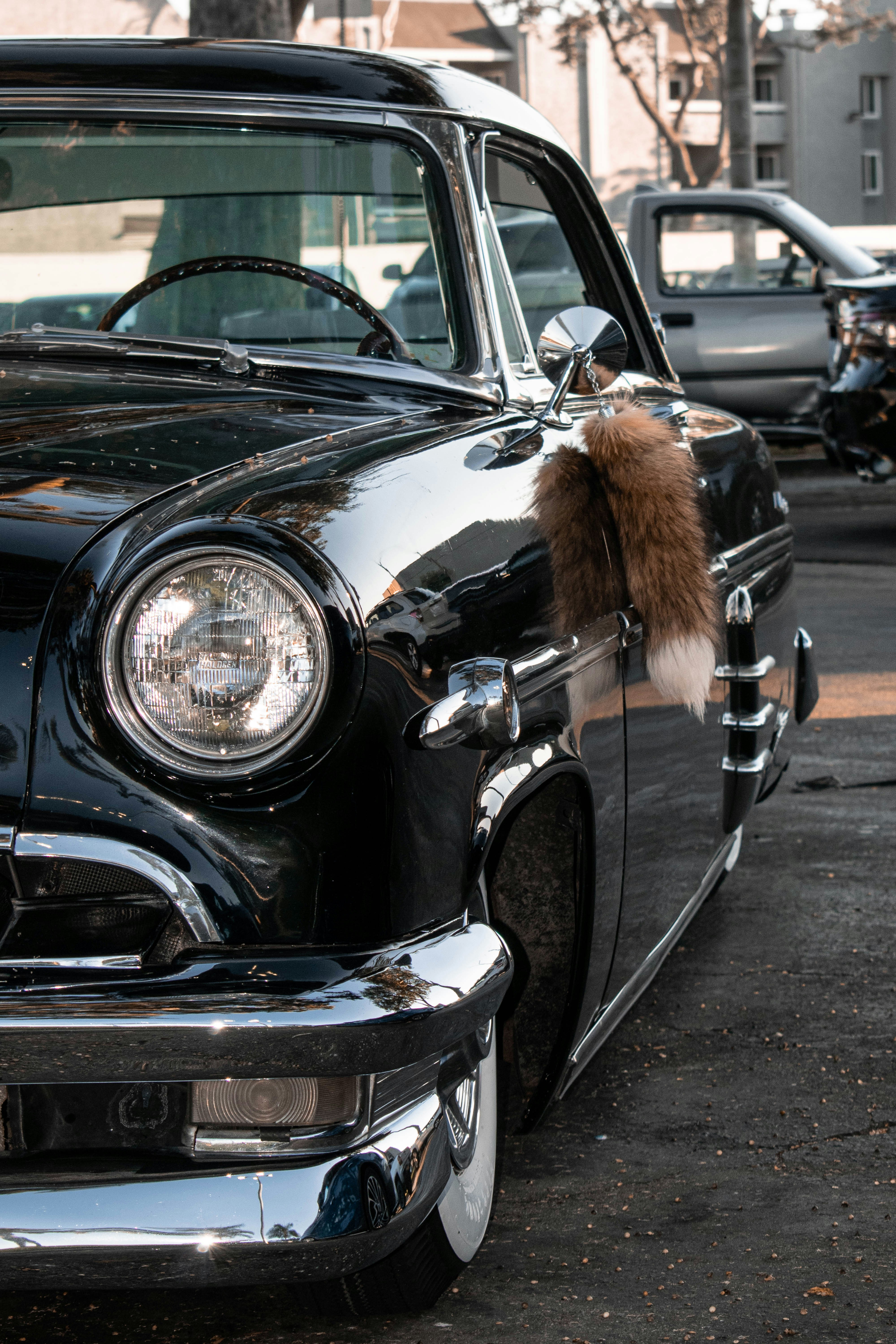 Midnight Gloss: A Vintage Car Dressed in Fur and Chrome