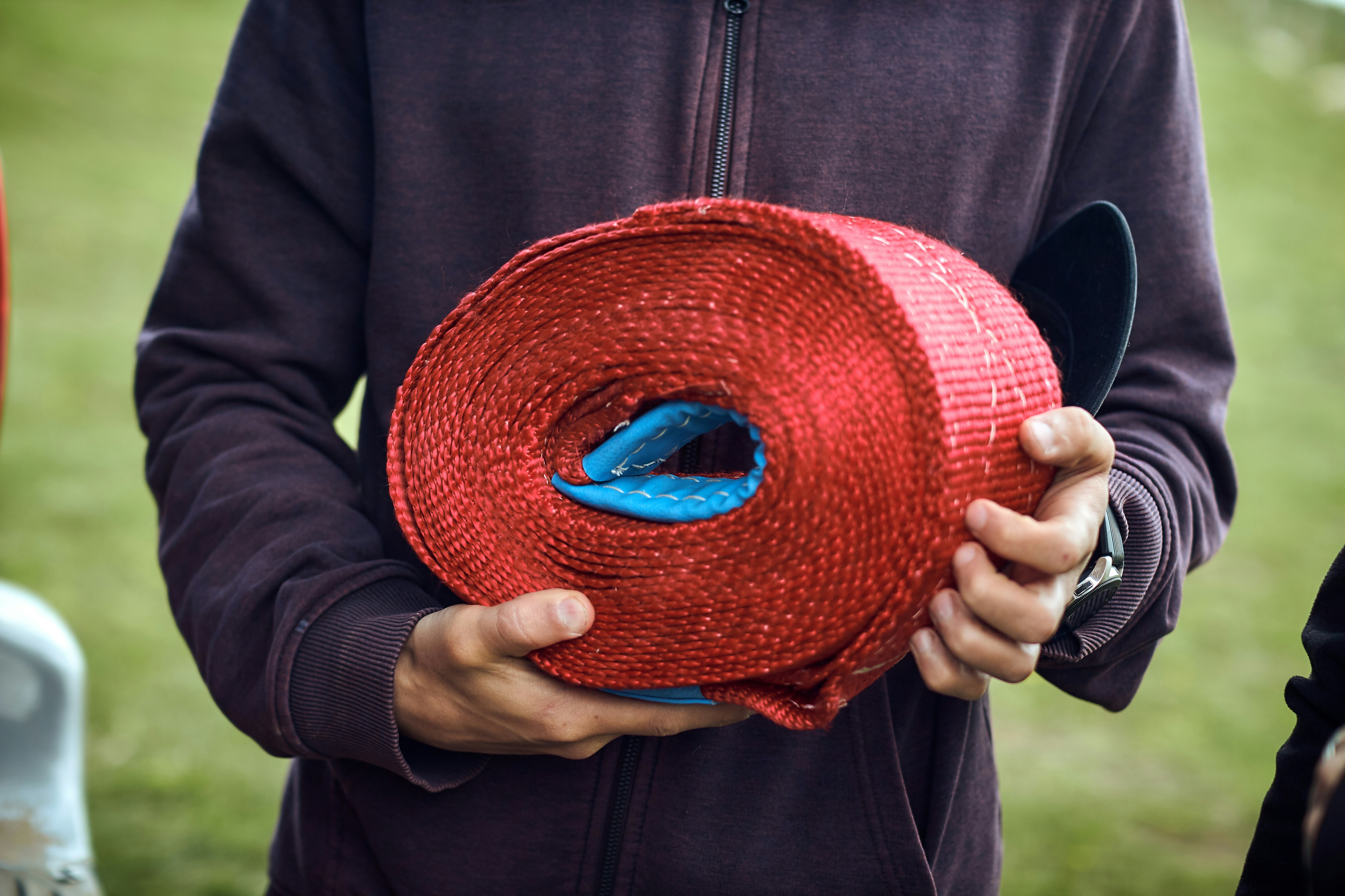 a person holding a red and blue ball