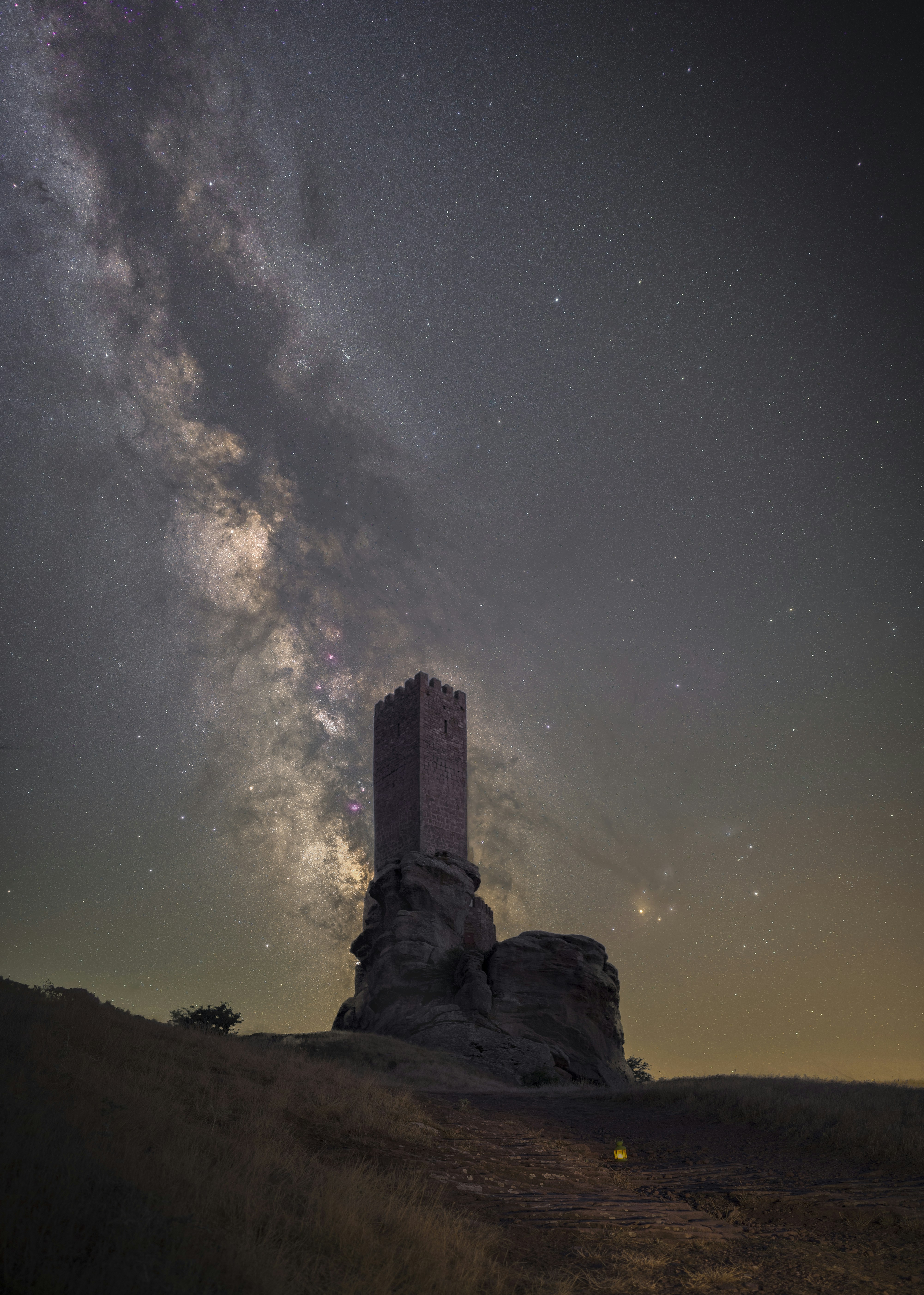 Stone Sentinel Beneath the Milky Way's Spiral VeilEmilio Garcia