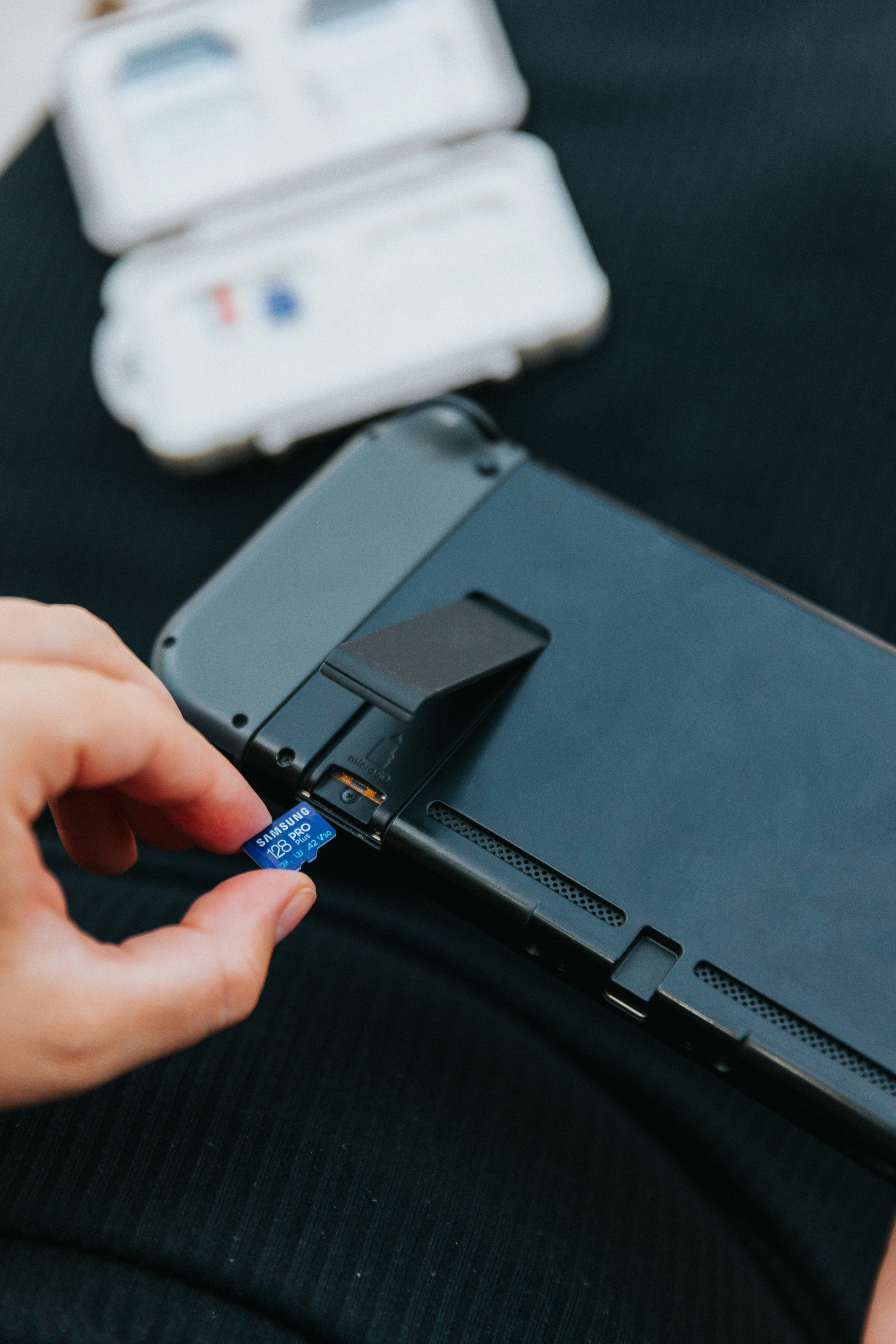 A hand holding a black rectangular device photo – Free Nintendo Image ...