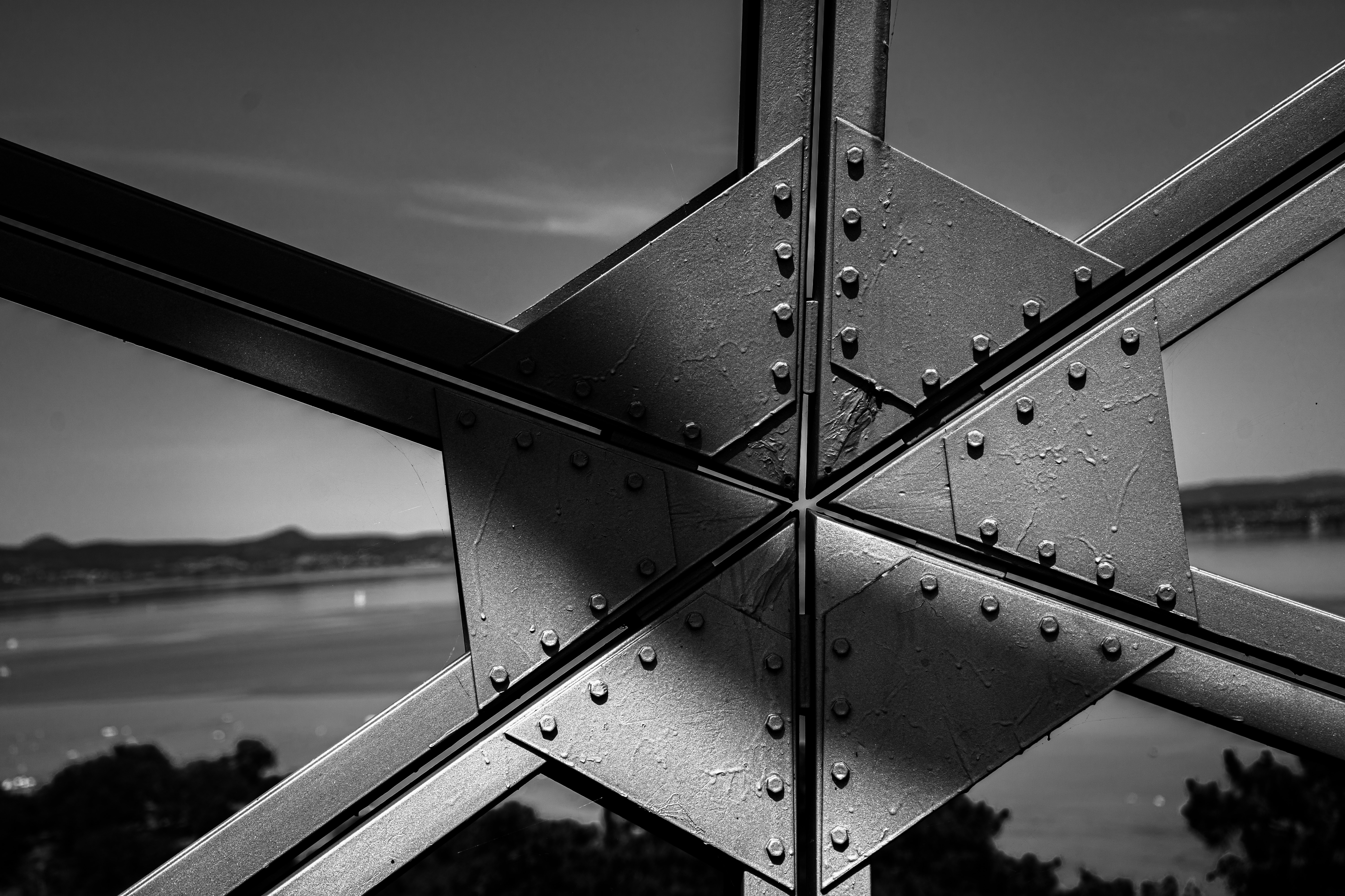 Riveted Convergence: A Steel Star Framing Meets a Quiet Lakeside Horizon