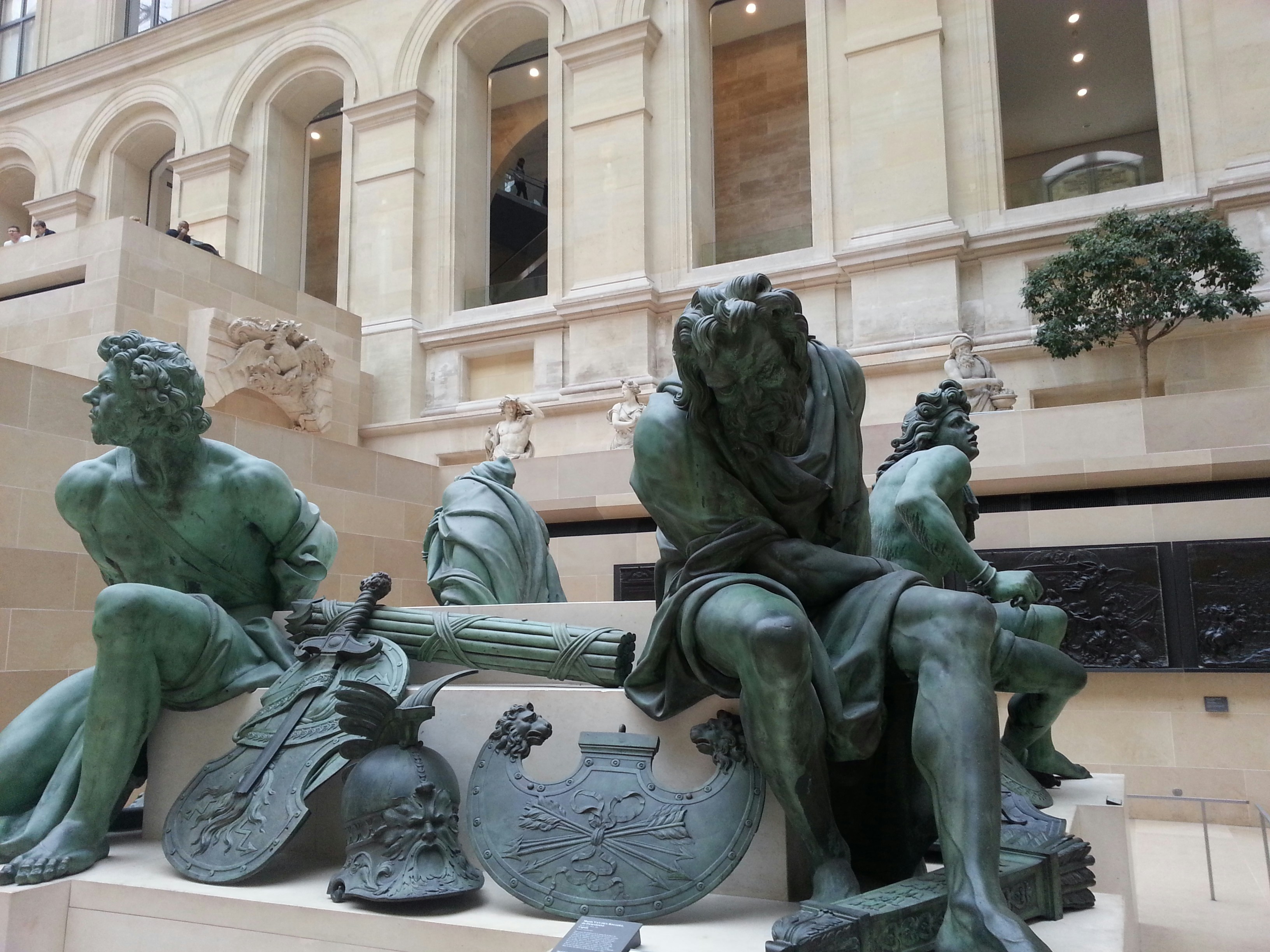a statue of a person riding a horse