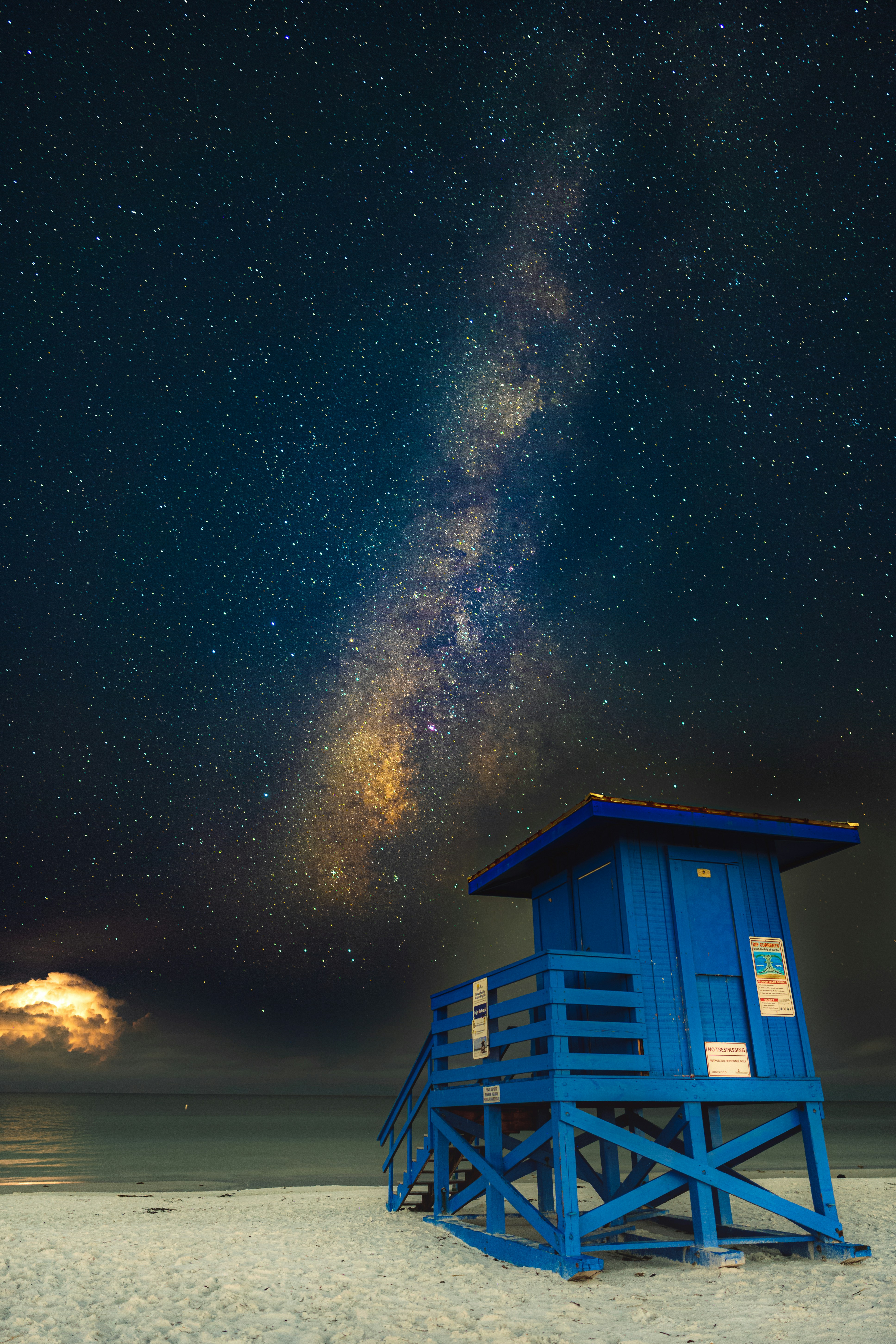 A blue shack on a beach with stars in the sky photo – Free Fl Image on ...