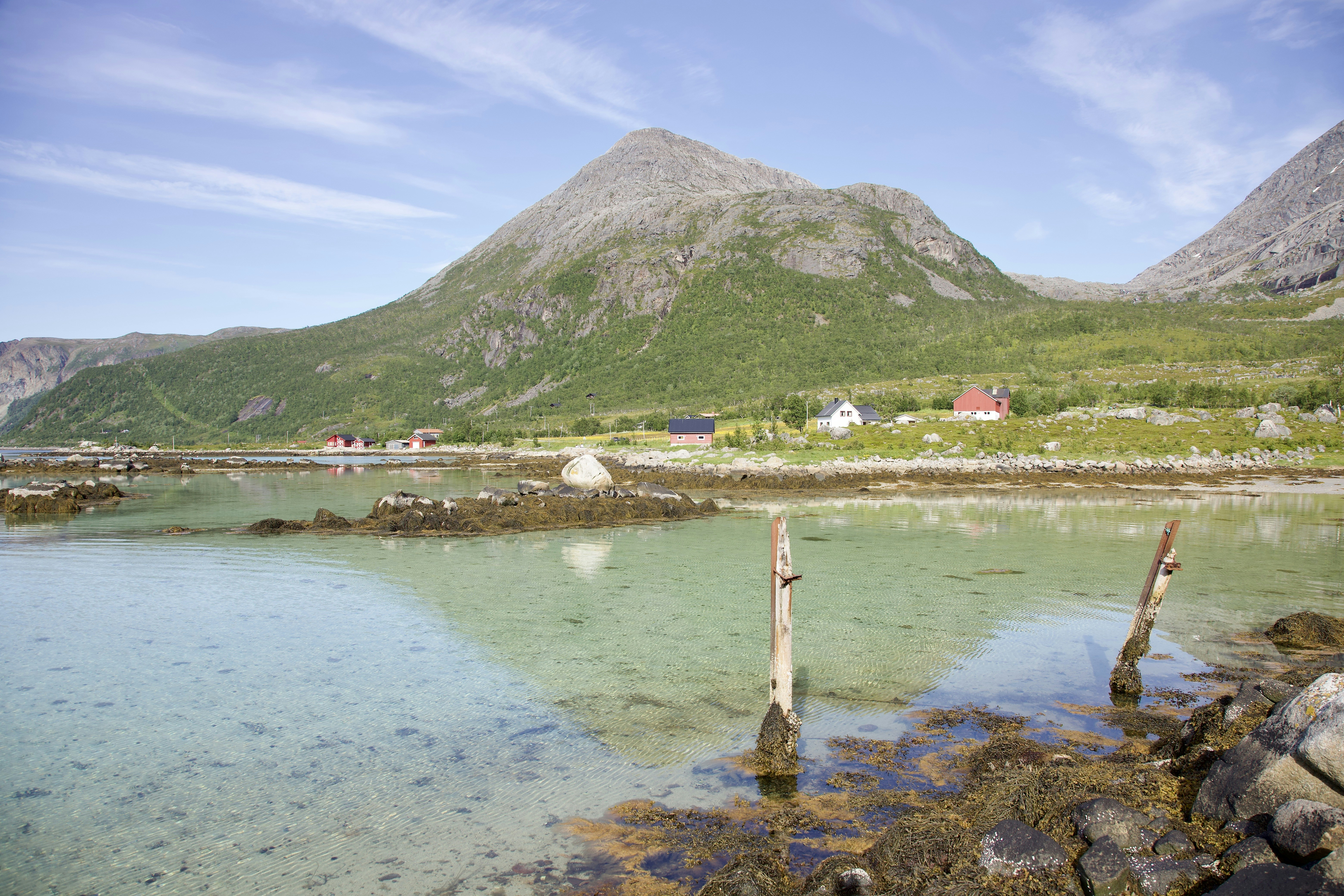 Cottages at the Fjord's Edge: Turquoise Waters Meet Granite Peaks