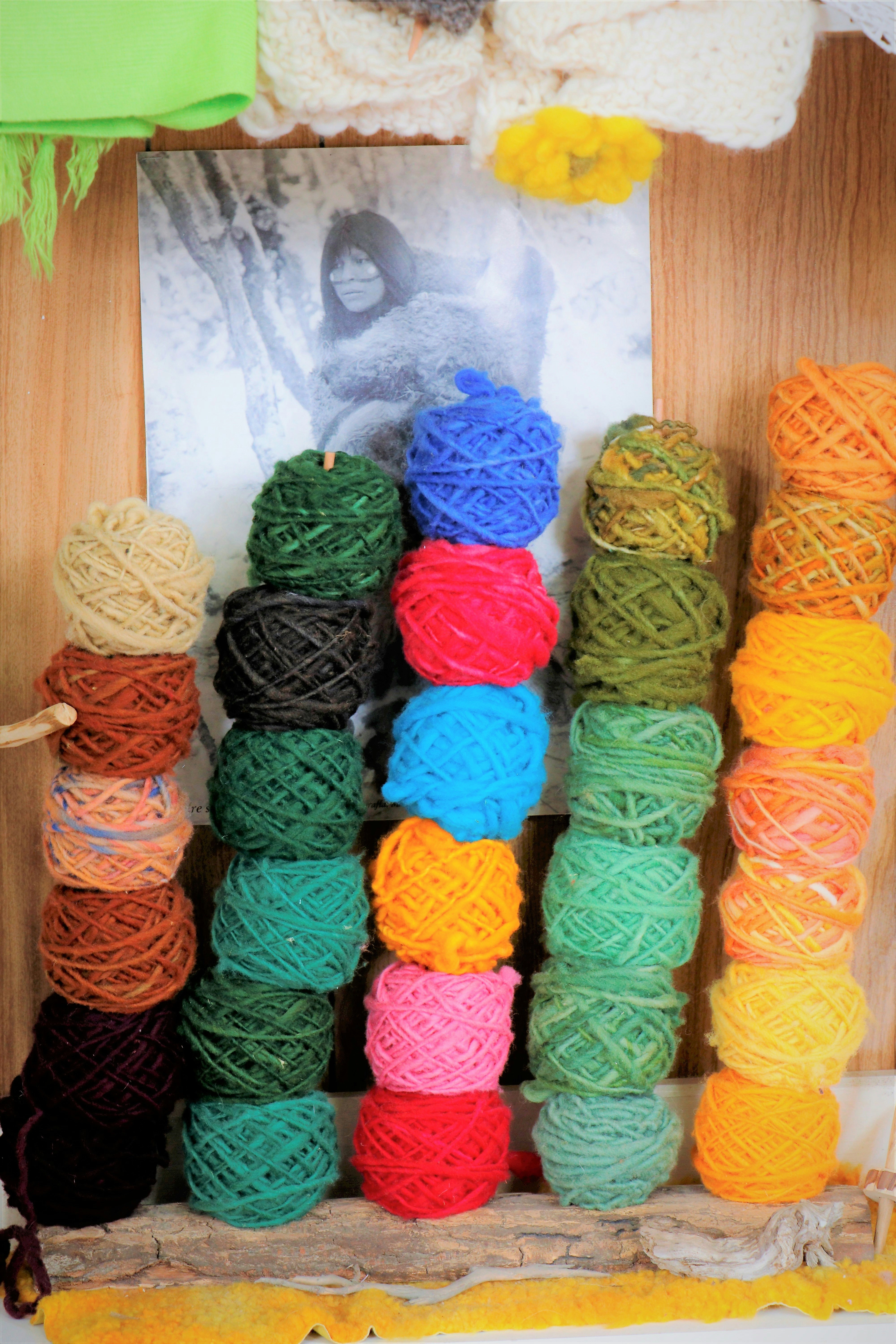 Vertical Yarn Towers Framing a Grayscale Portrait