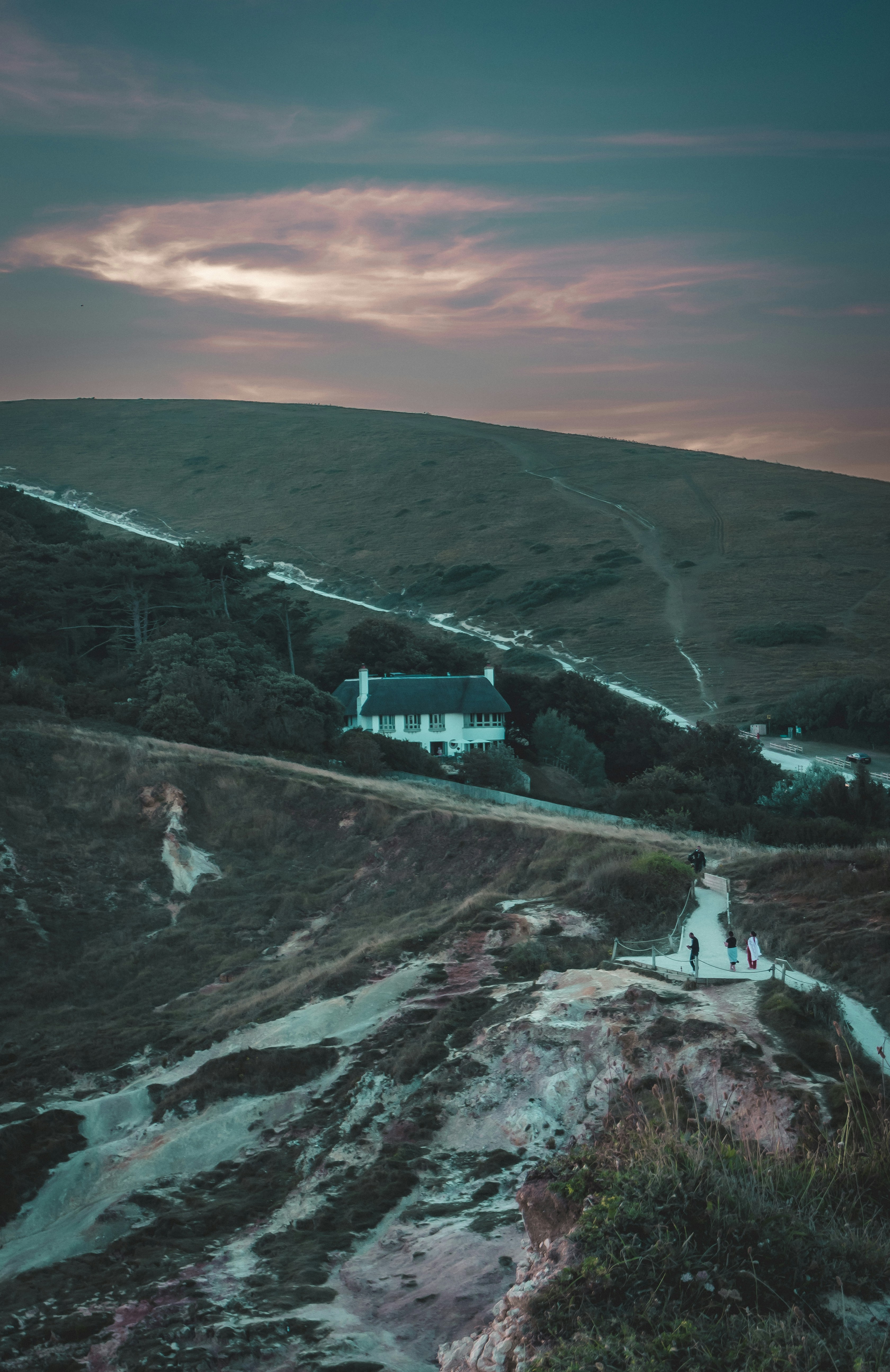 Cliffside Path to a Quiet House at Dusk