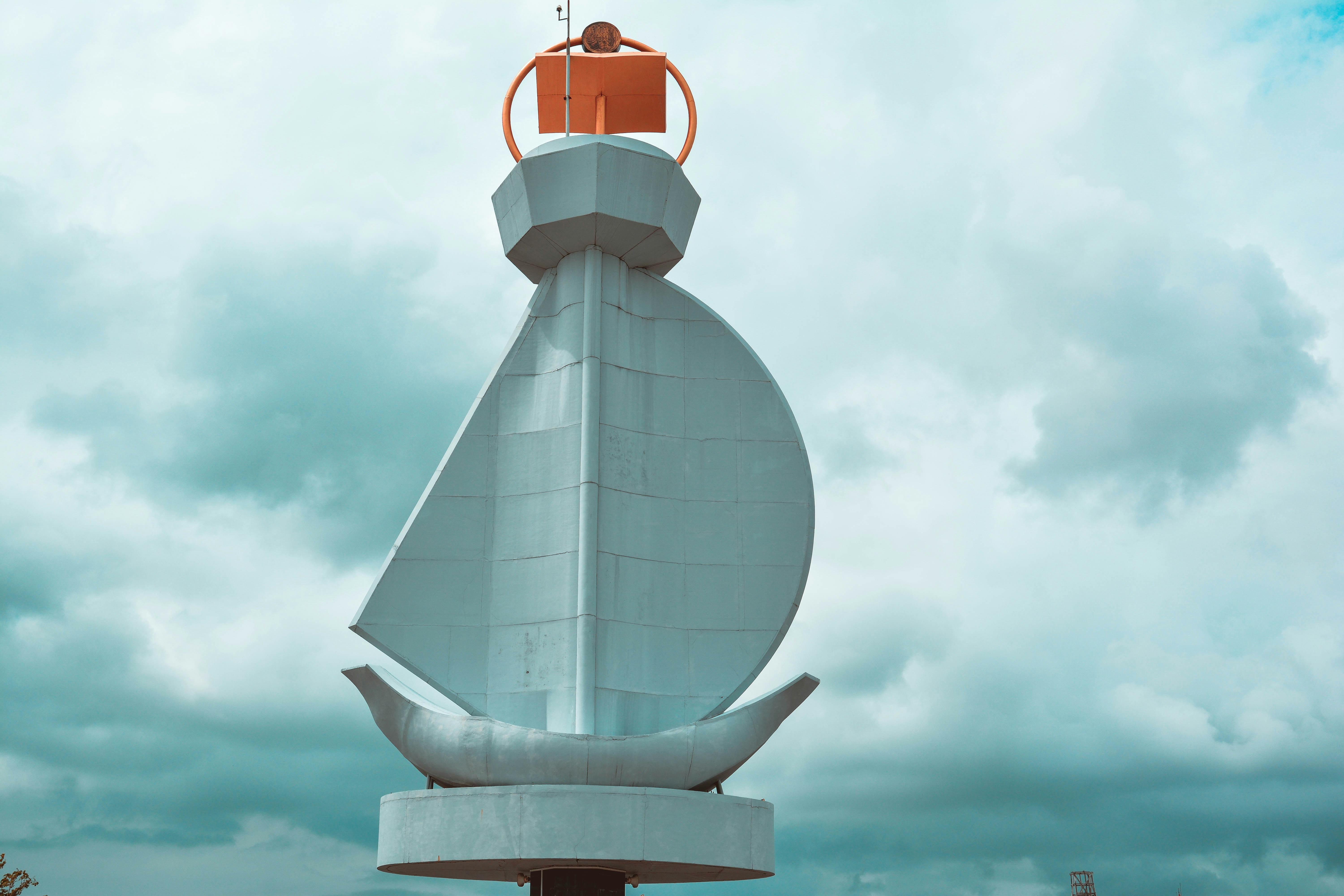 The Crescent Sail: Abstract Monument Against a Turquoise Sky