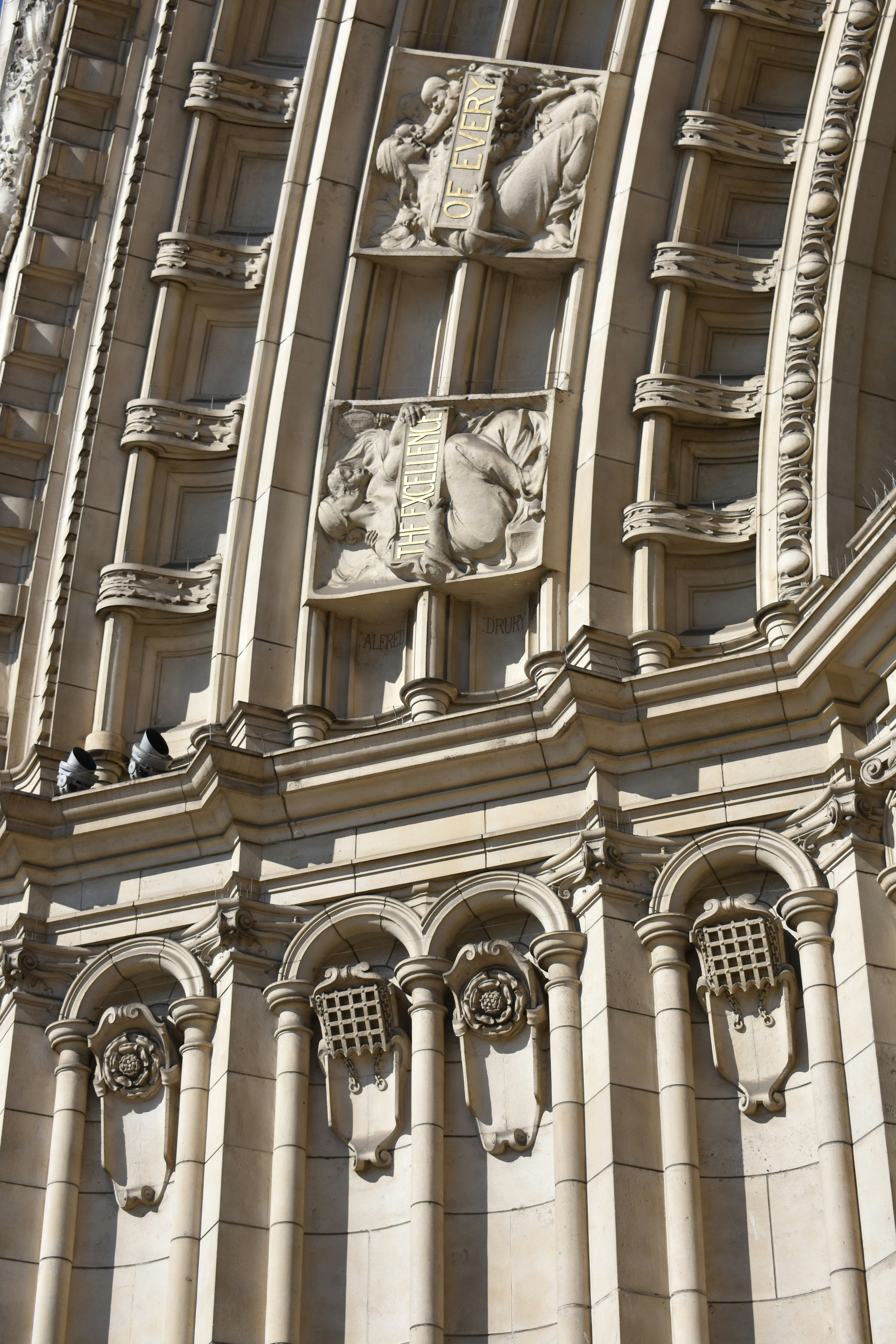 A building with sculptures on the side photo – Free Building Image on ...