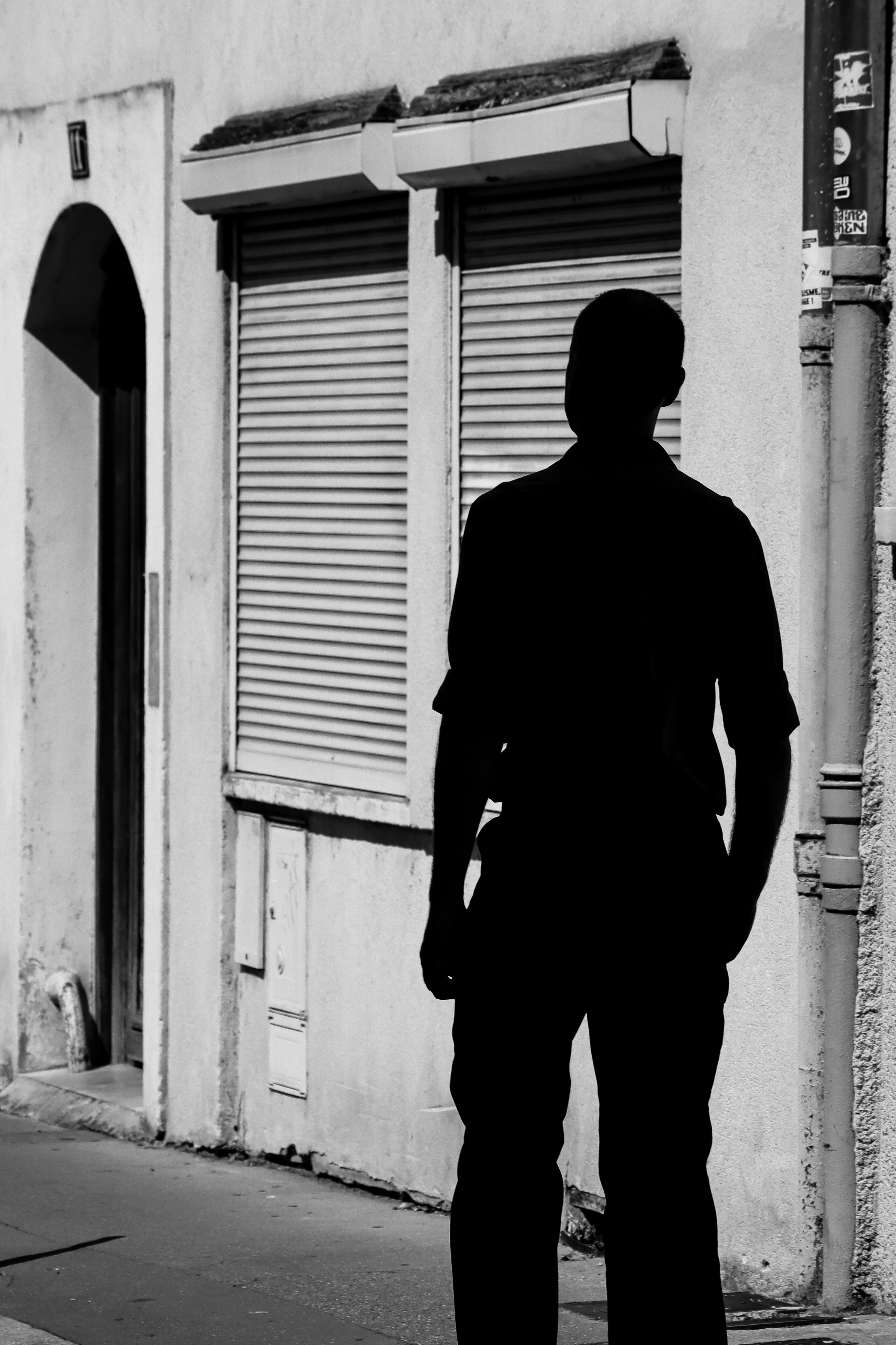 A man walking out of a building photo – Free Street photography Image ...