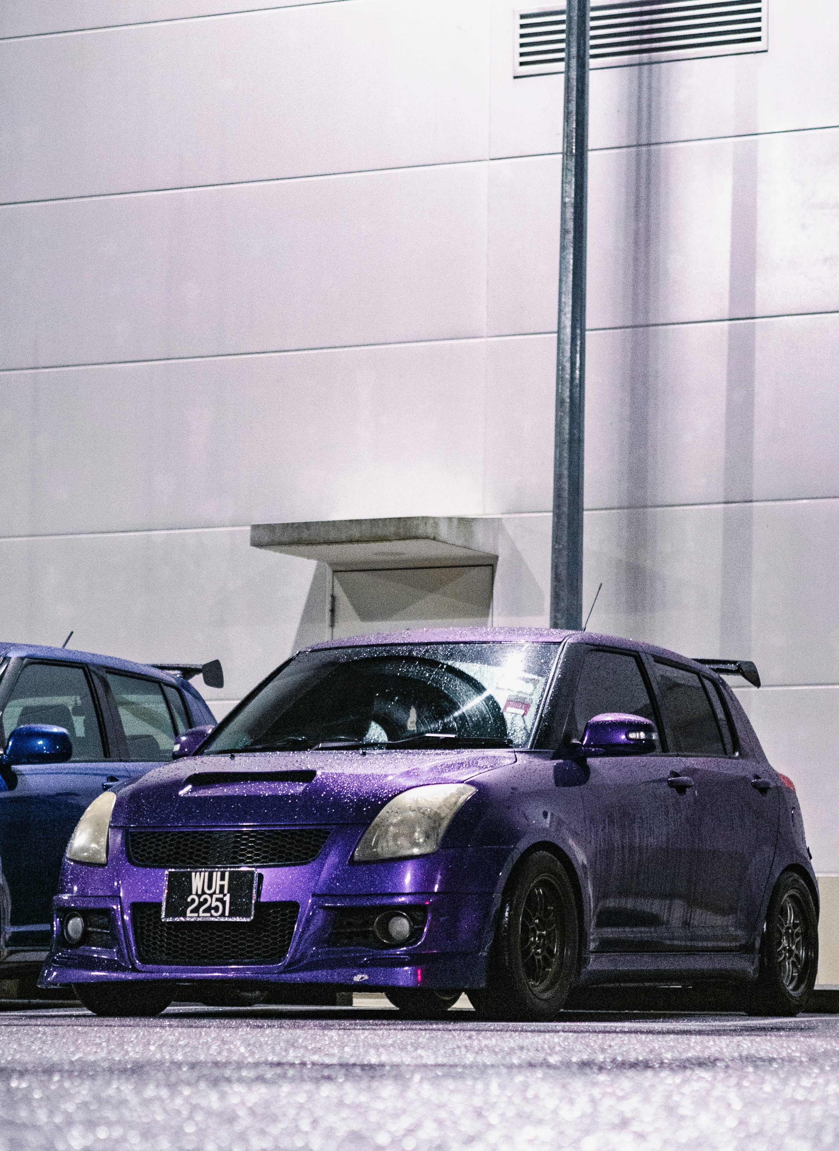 Violet Turbo: A Tuned Hatchback Anchored by an Industrial Backdrop