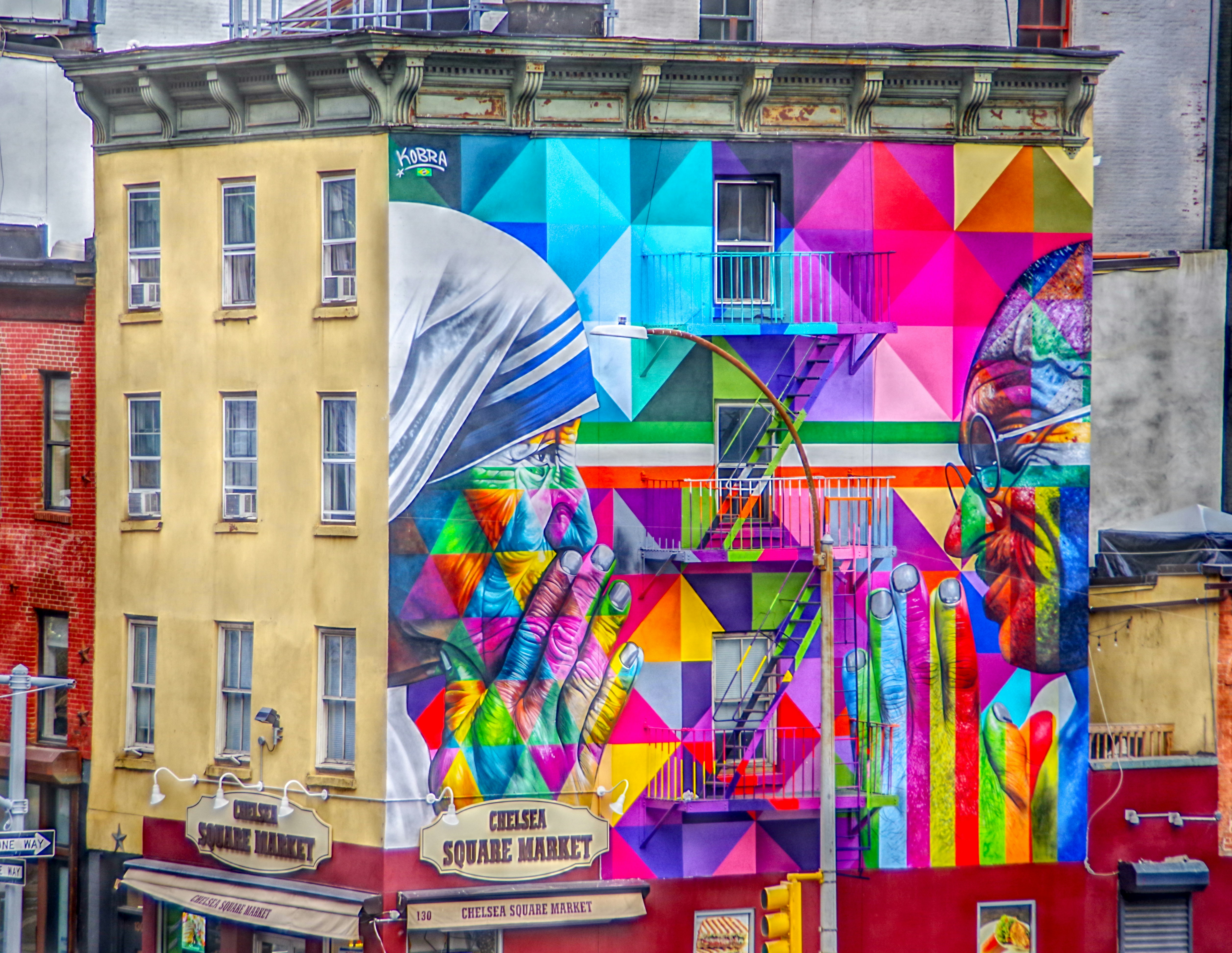 Building mural as seen from the High Line near Chelsea Market.  | a building with a mural on it