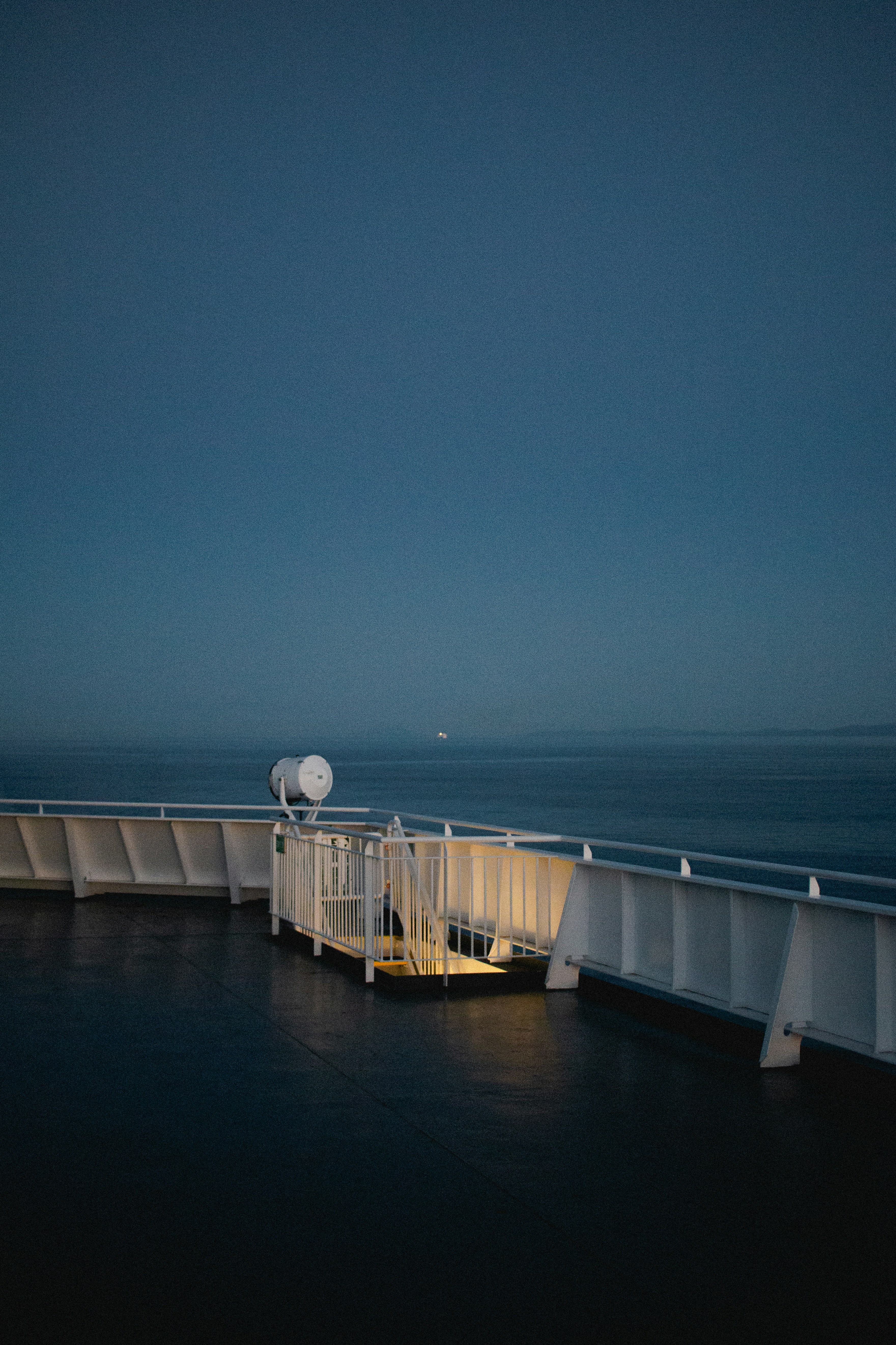 Blue Hour Beacon on the Quiet Ocean Deck