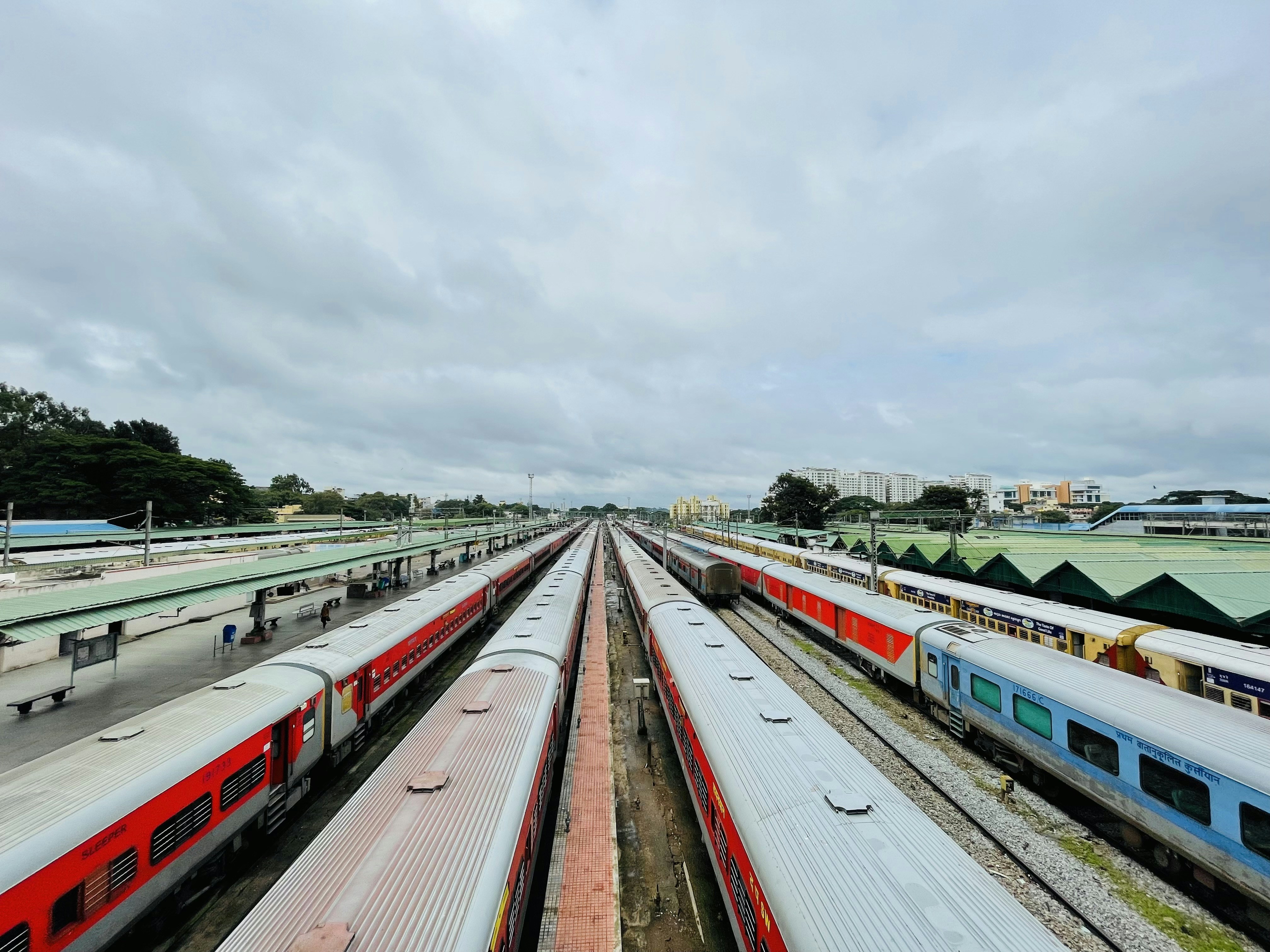 A group of trains are parked in a station photo – Free Vehicle Image on ...