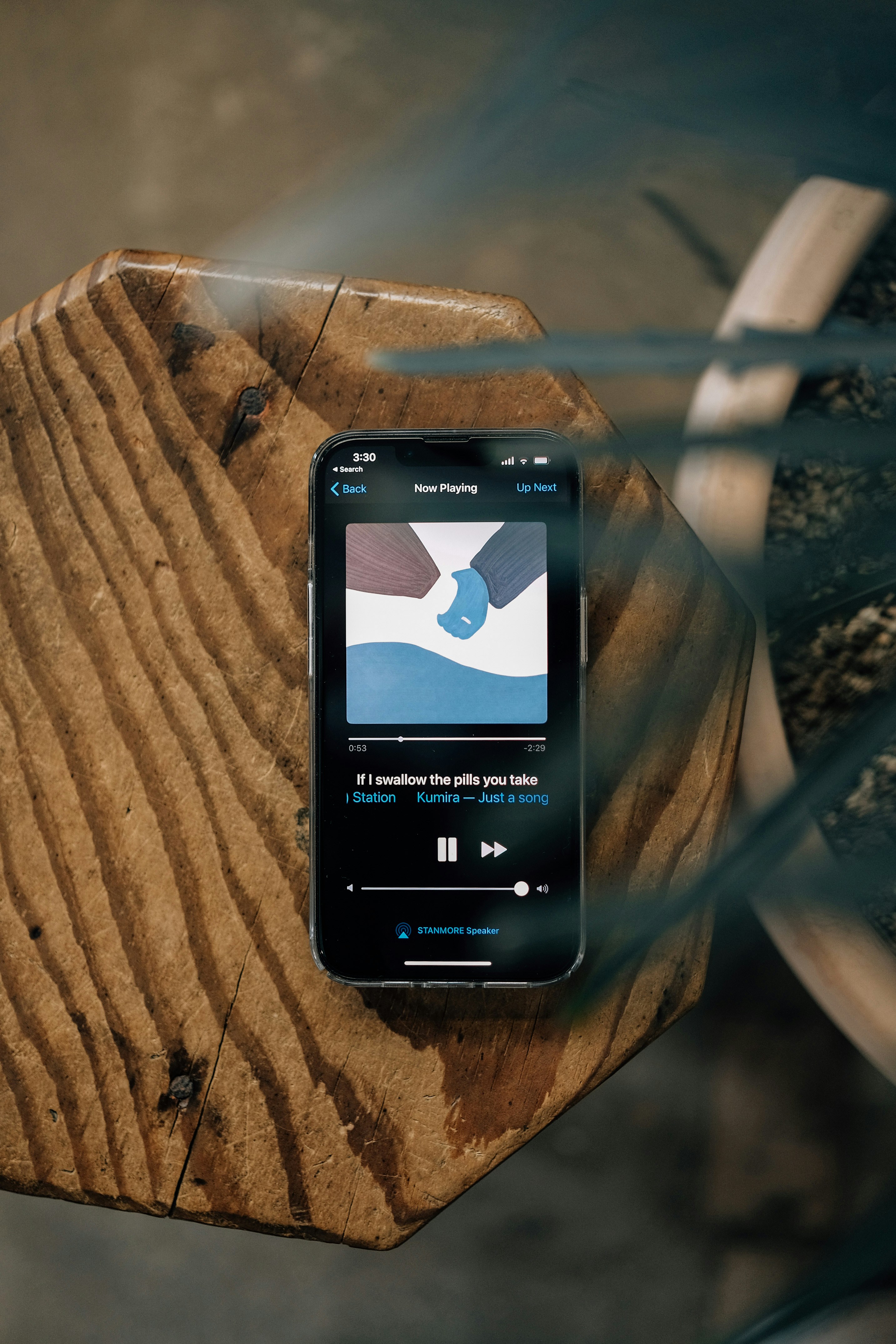 Pocket Screen Serenade: A Phone Resting on Weathered Wood