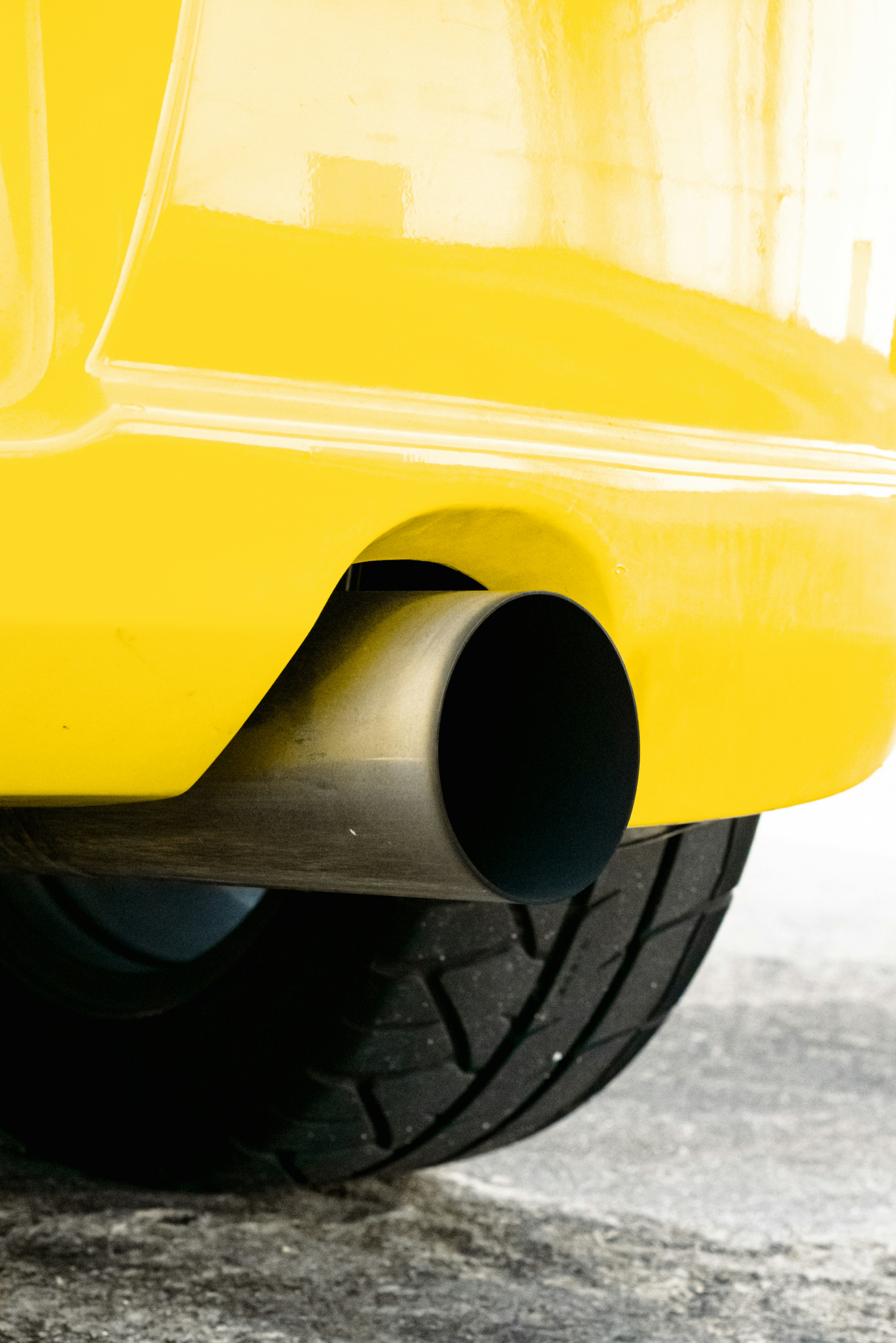 Luminous Yellow Rear Exhaust: A Tight Portrait of Speed and Form