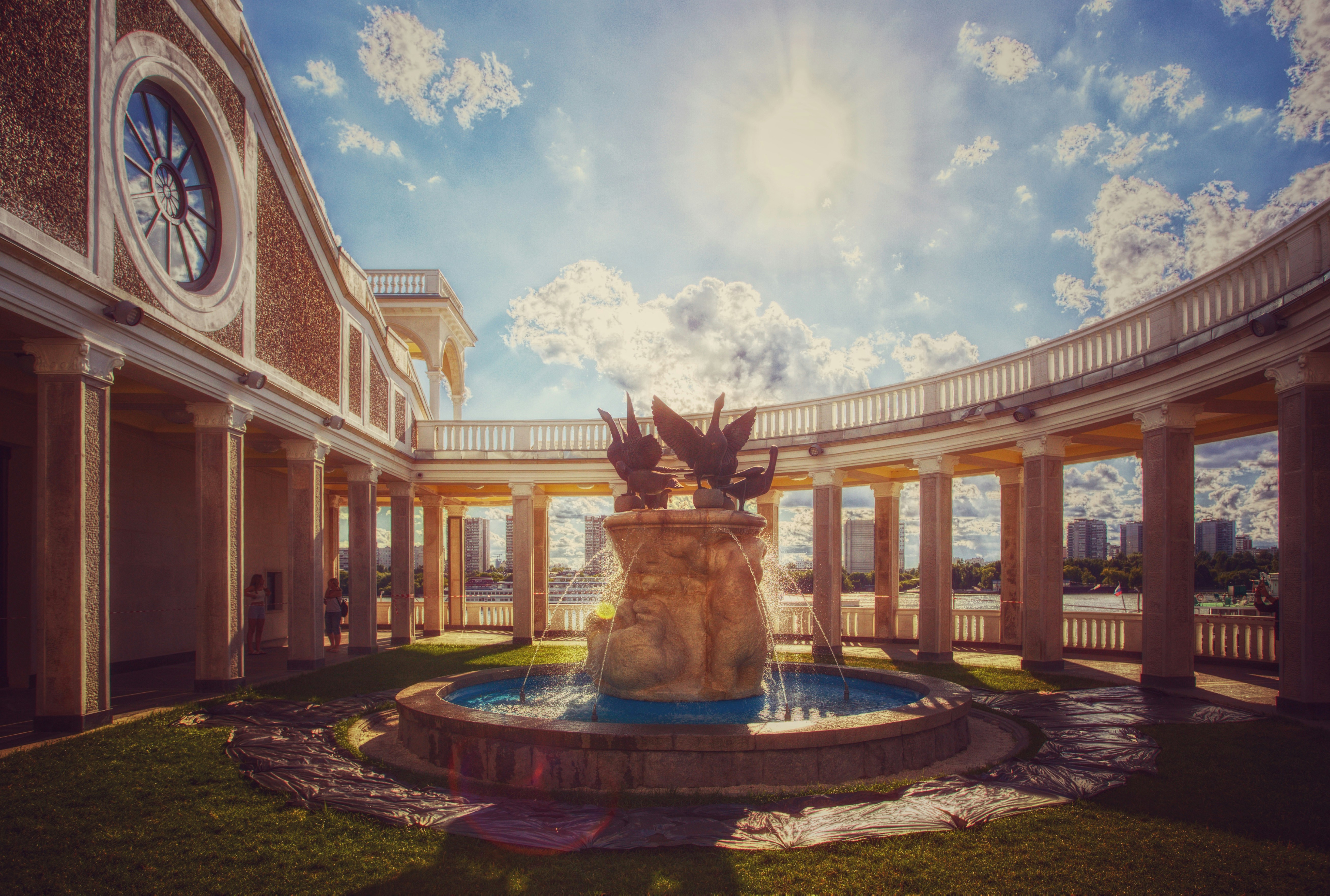 Sunlit Rotunda Fountain: A Classical Terrace in Ocean-View Light