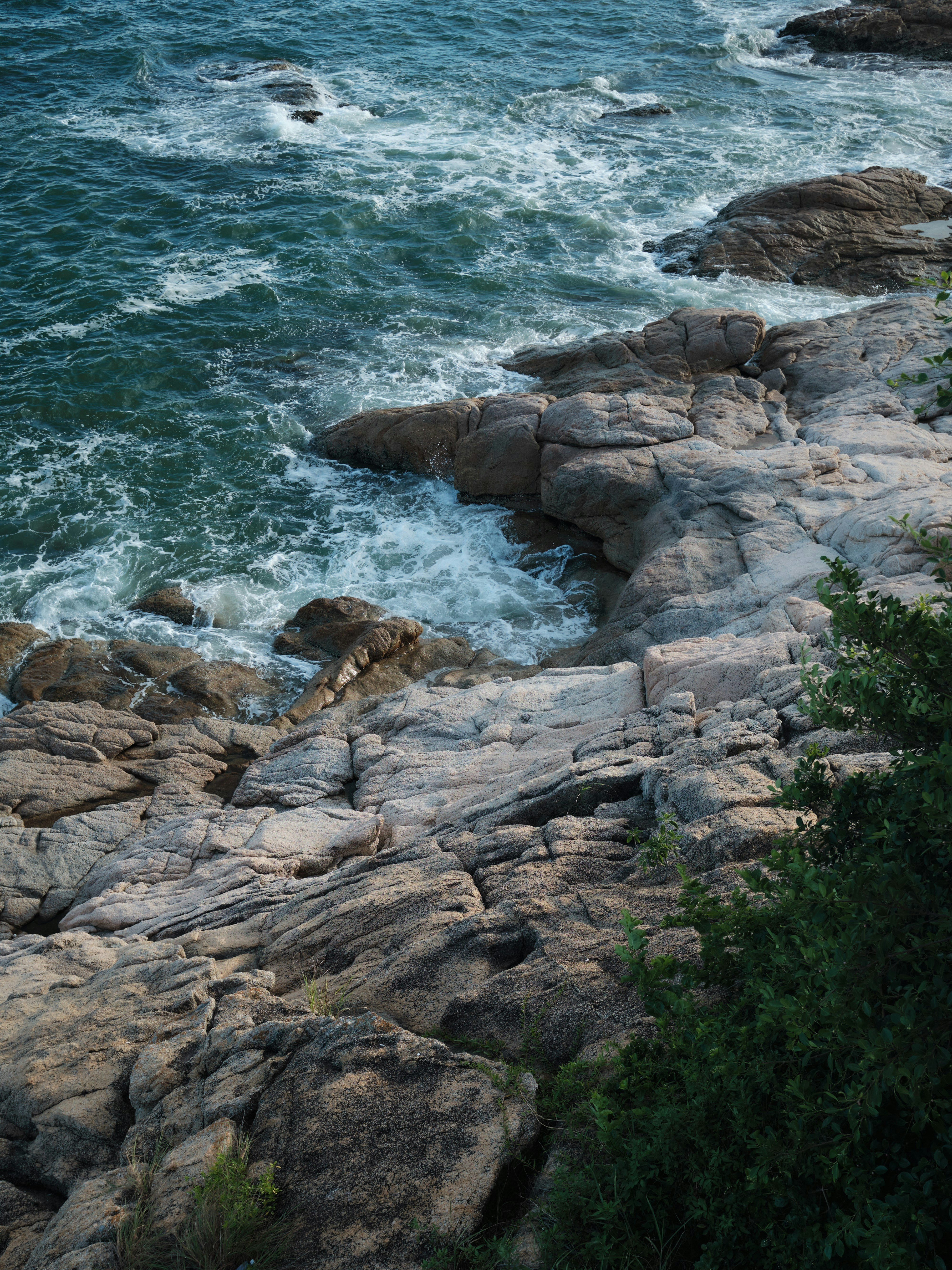 Weathered Granite Ridge Meets the Sea's Whitecaps